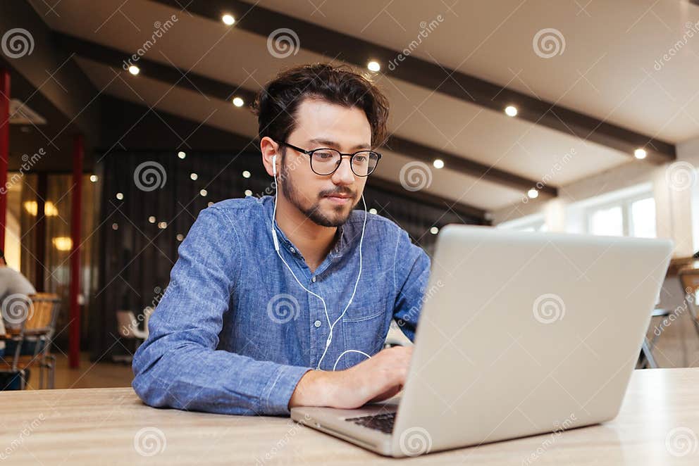 Man Sitting at the Table with Laptop in Office Stock Image - Image of ...