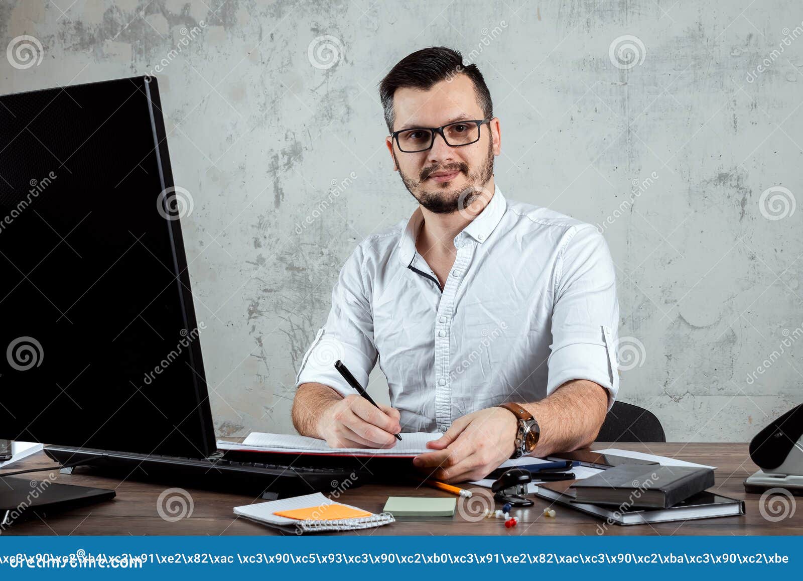 A Man, a Man Sitting at a Table in the Office, Working on Important ...