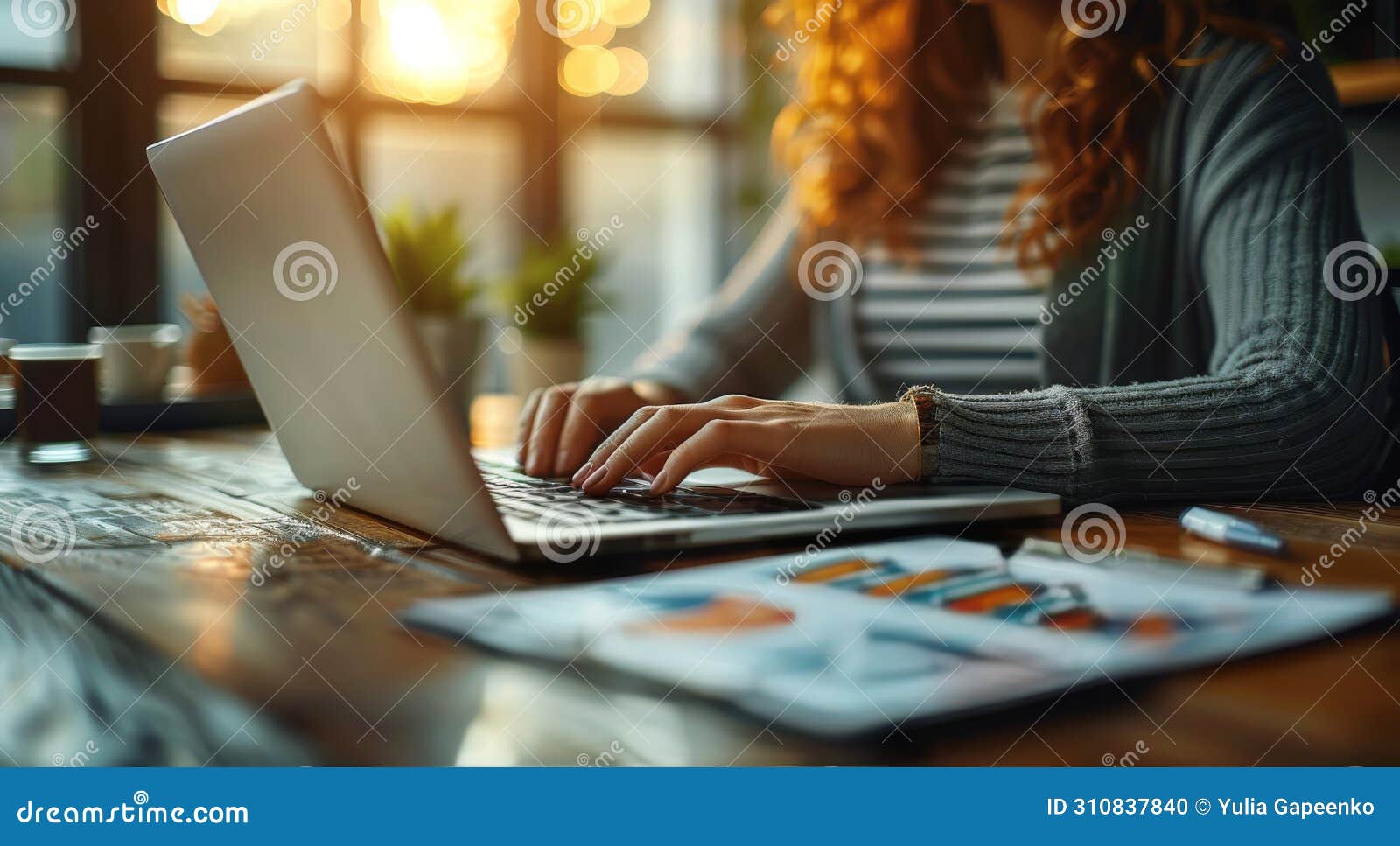 Man Sitting at Table Using Laptop Computer Stock Photo - Image of ...
