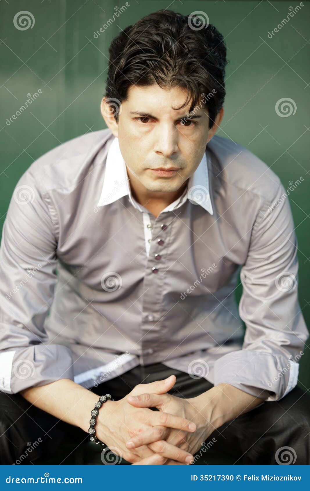 Man sitting and thinking stock photo. Image of latino - 35217390