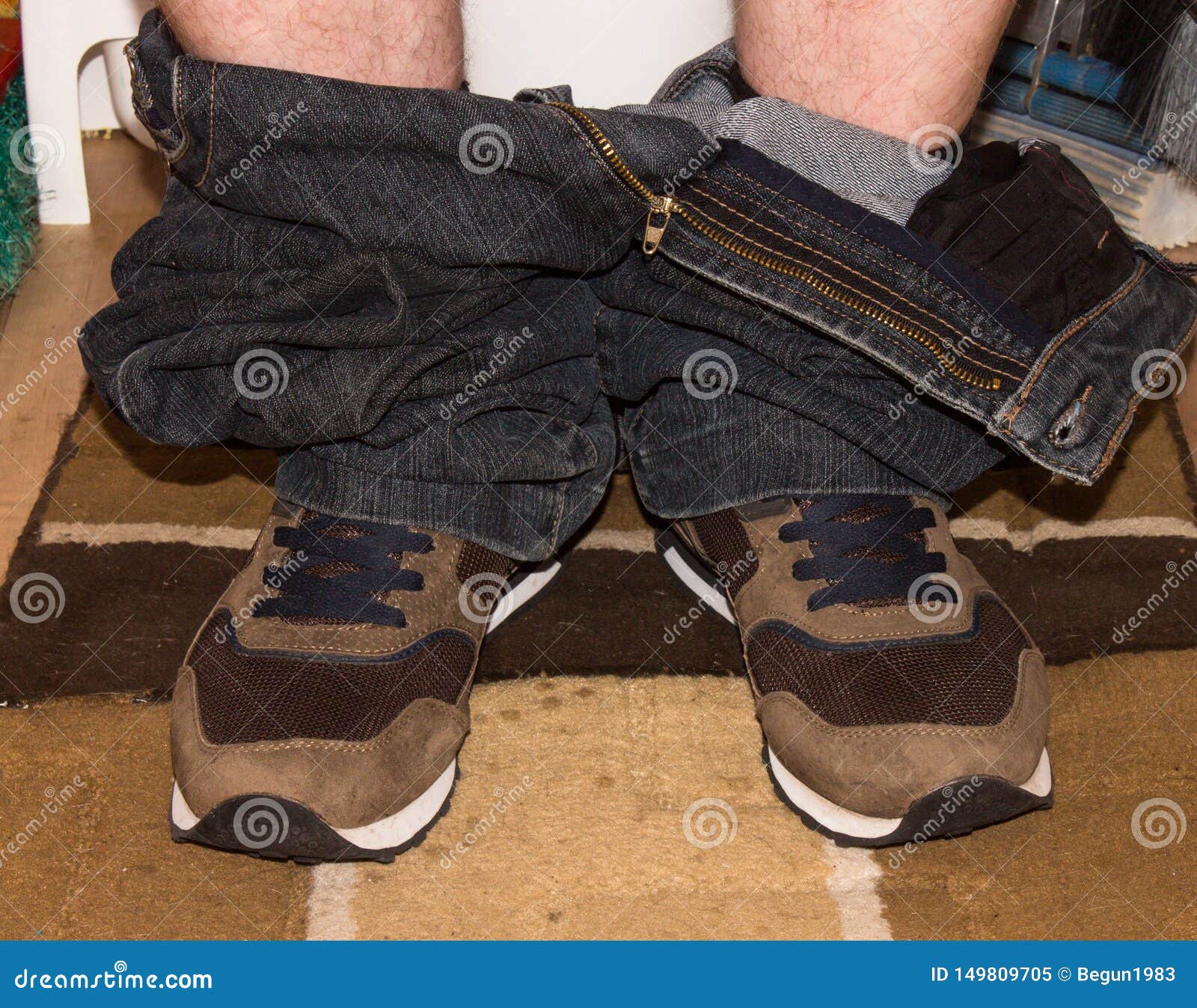 Man Sitting on the Toilet with His Pants Down. Stock Image - Image of ...