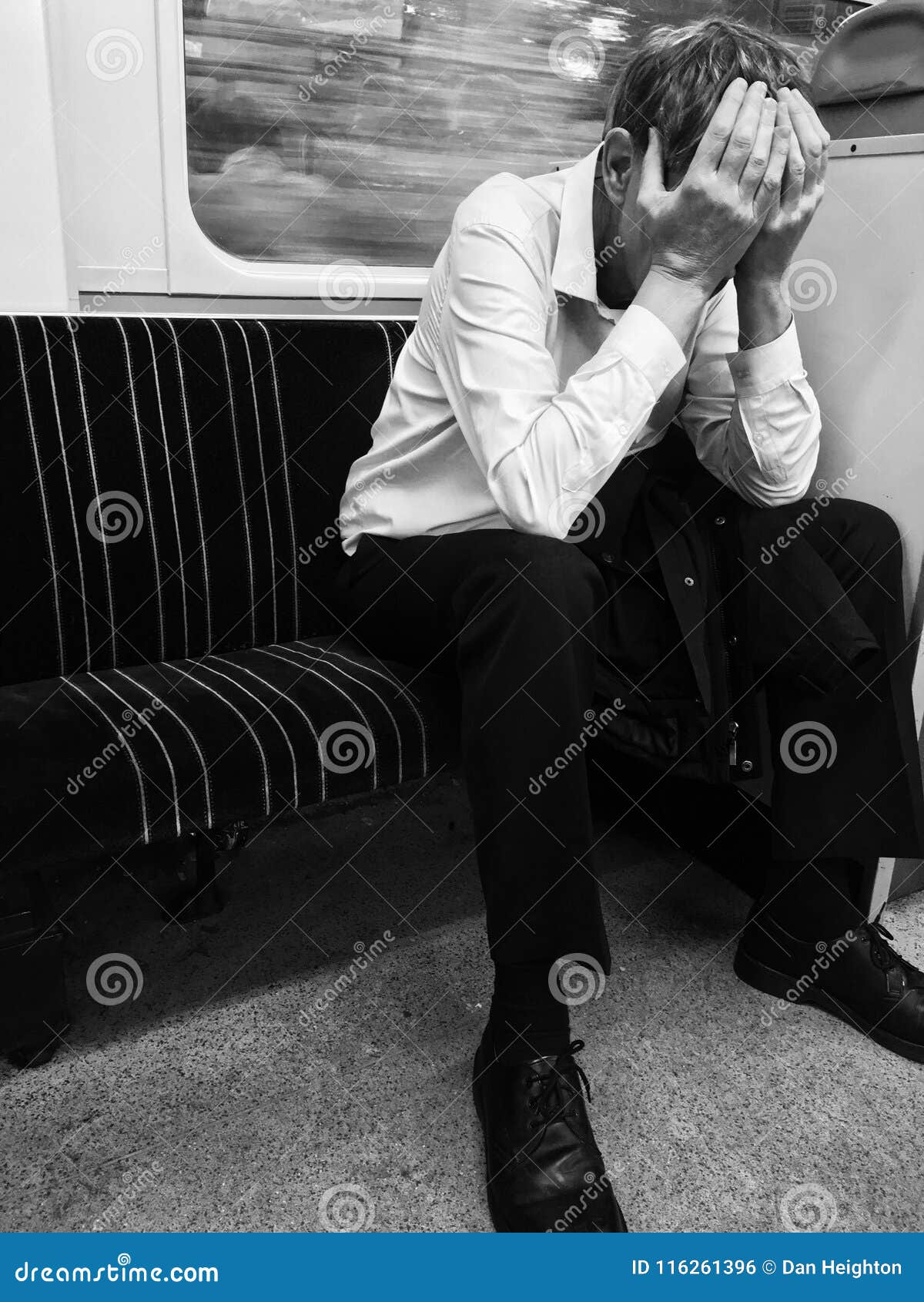 MAN SITTING on TRAIN with HEAD in HANDS Editorial Photo - Image of ...