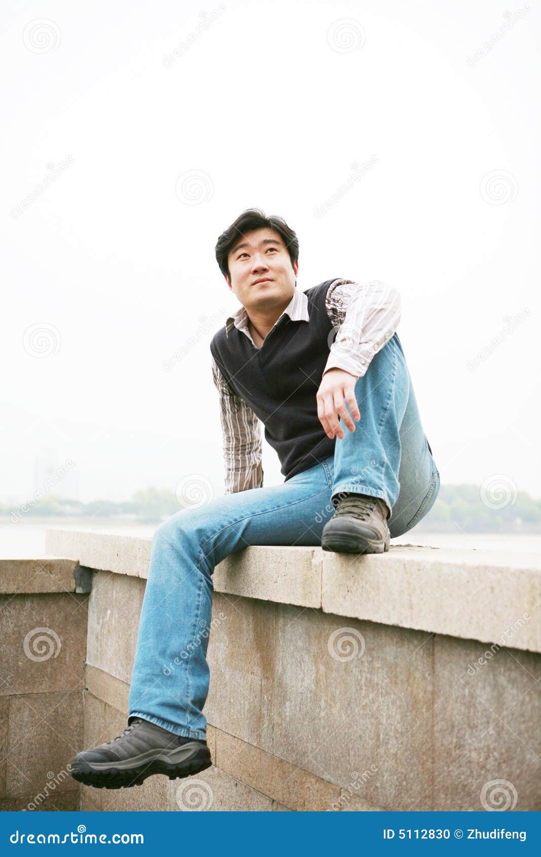 Man sitting on wall stock photo. Image of outdoor, china - 5112830