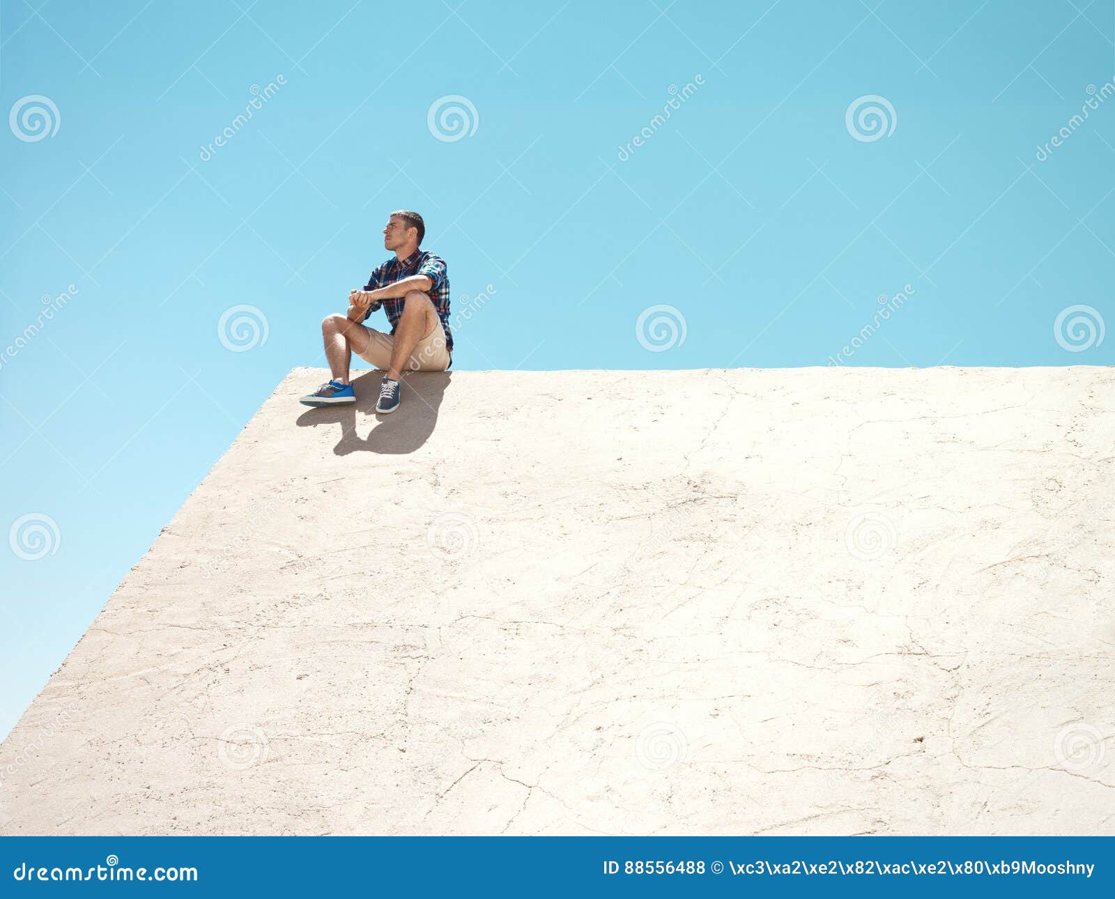 Man sitting on a wall stock photo. Image of climbing - 88556488