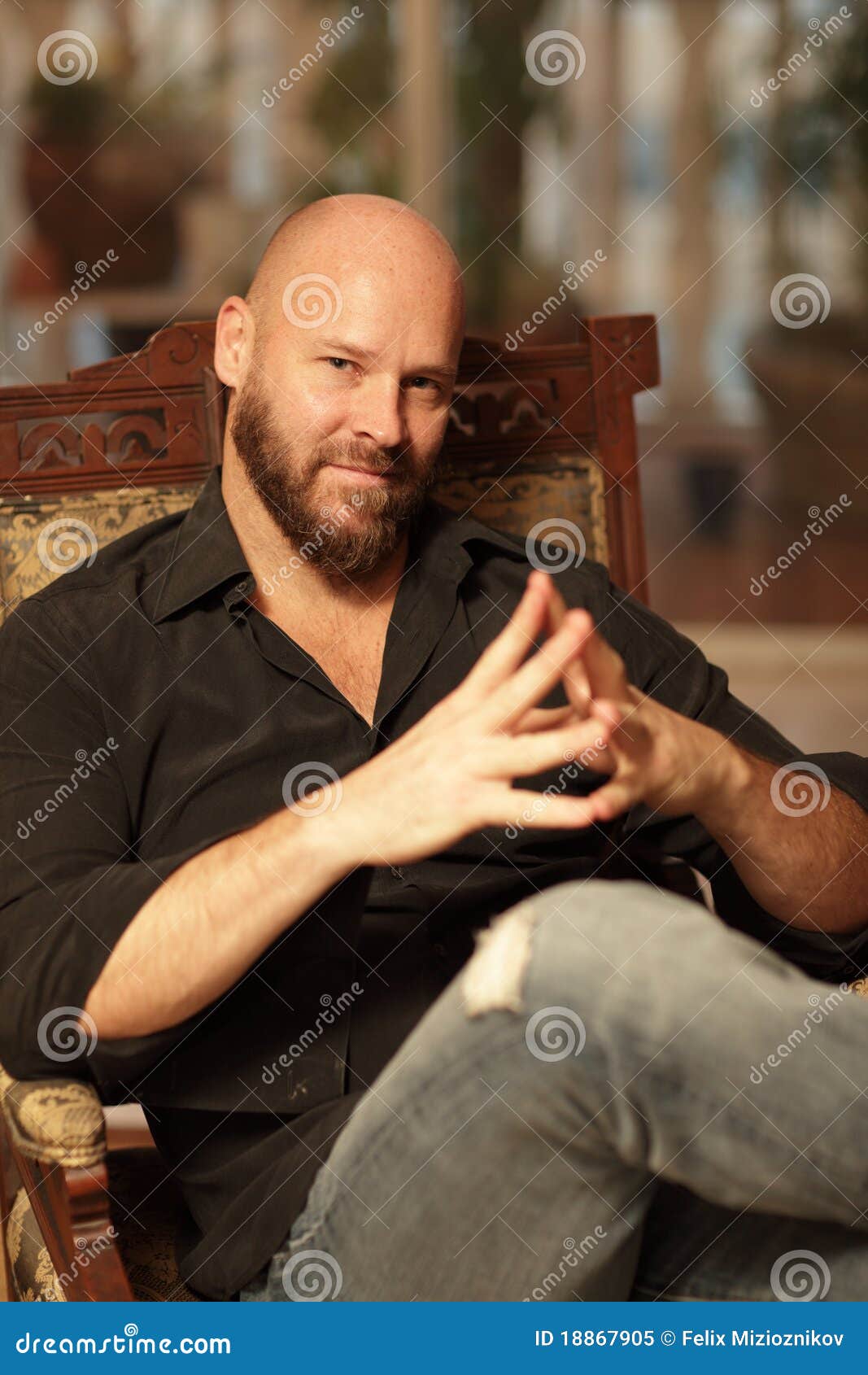 Man Sitting on a Wooden Chair Stock Image - Image of joyous, hands ...