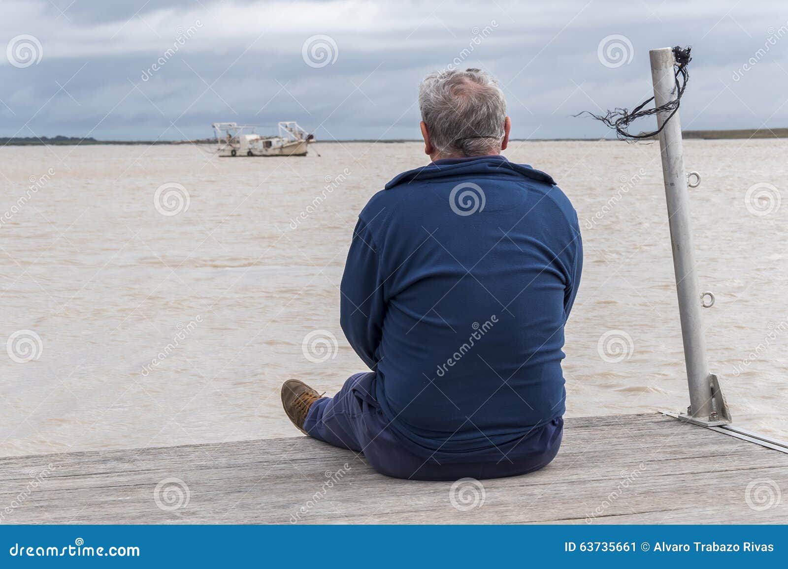 Man Sitting on Wooden Pier Facing the River Thinking Stock Image ...