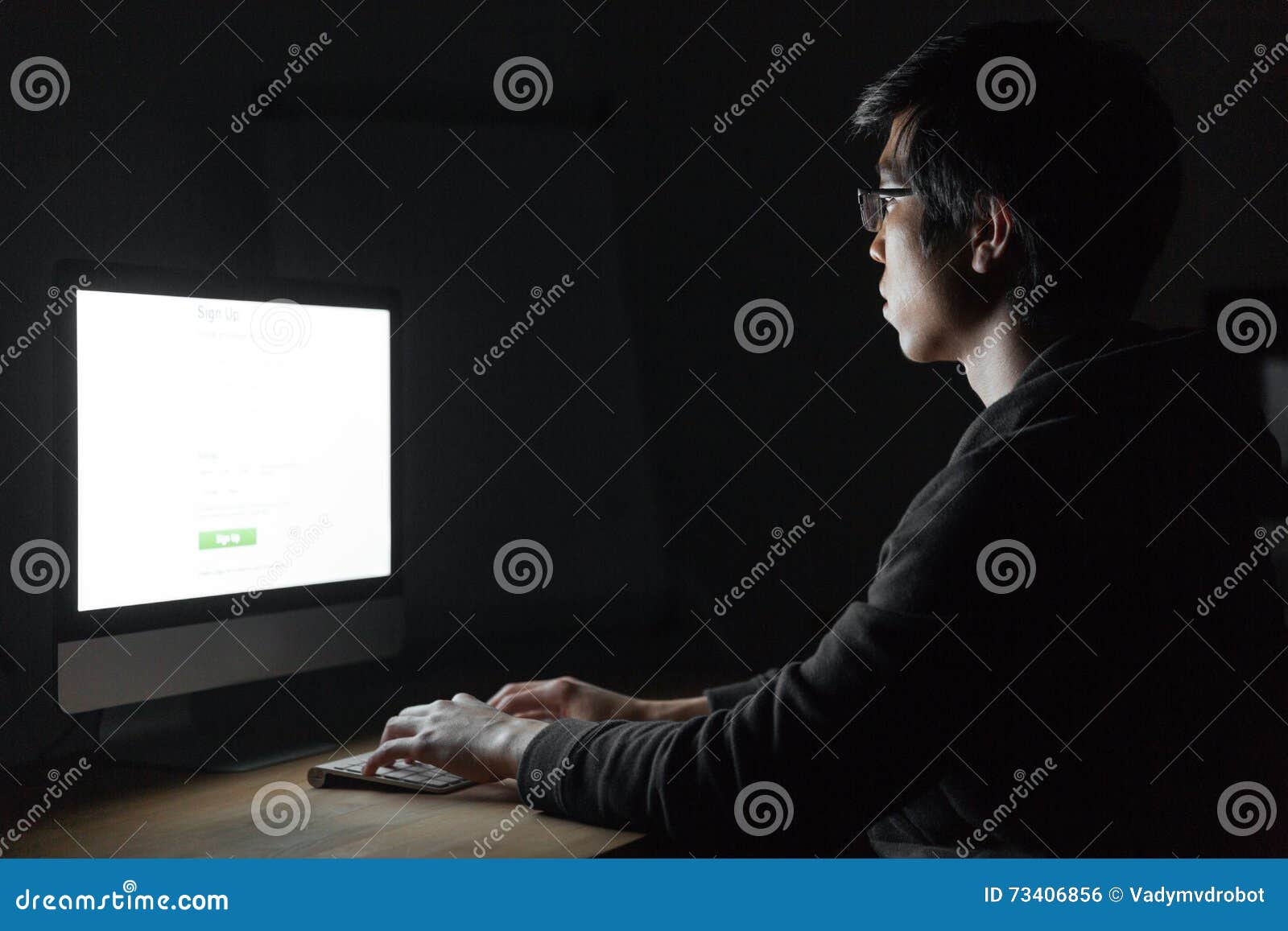 Man Sitting and Working with Computer in Dark Office Stock Photo ...