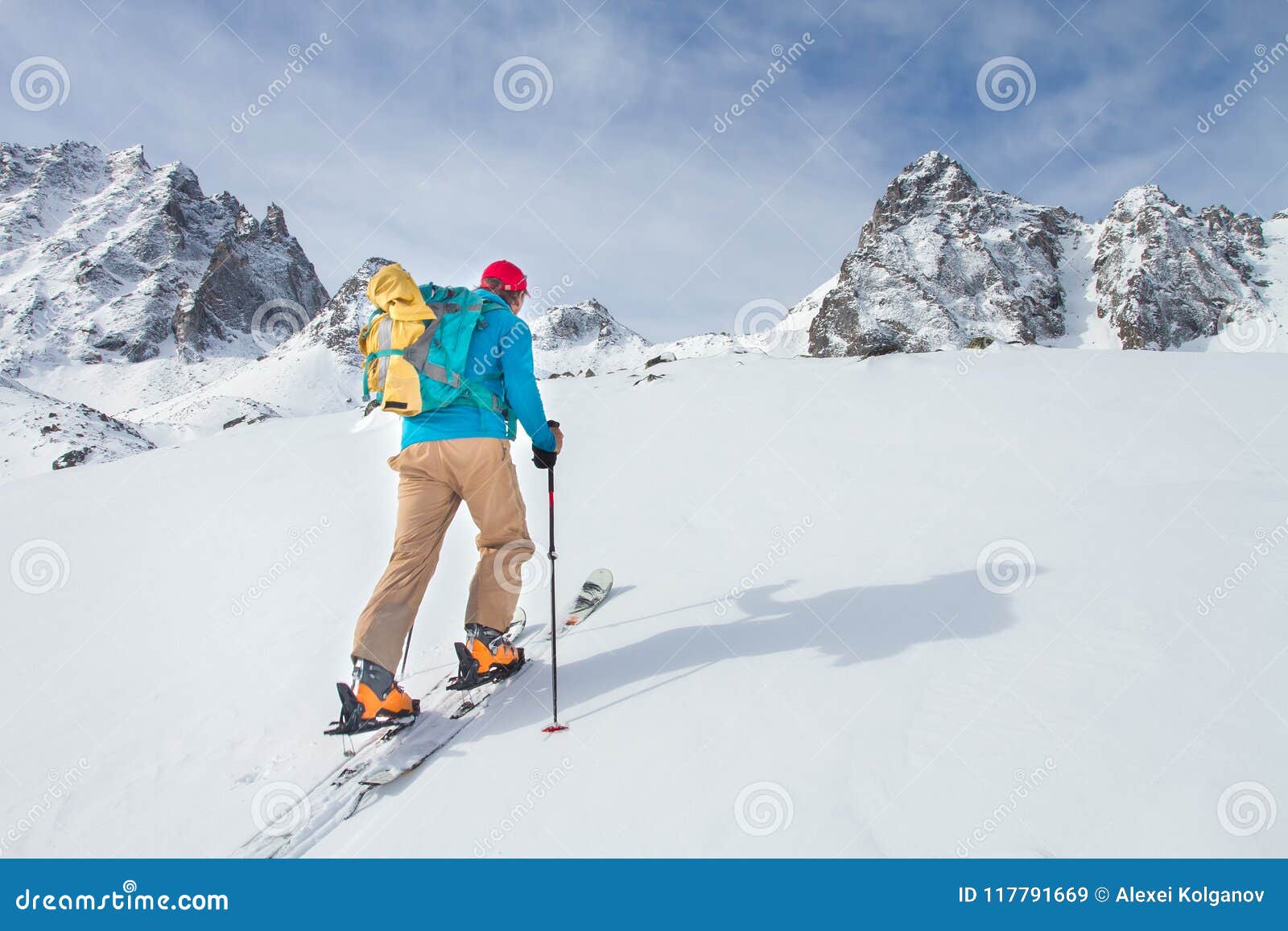 A Skier Walks in the Mountains Stock Image - Image of guide, backpack ...