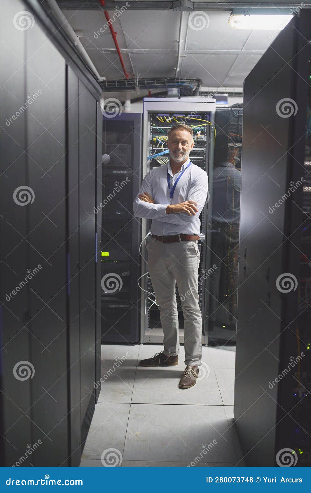 The Man Skilled in Multiple Systems. Portrait of a Mature Man Working ...