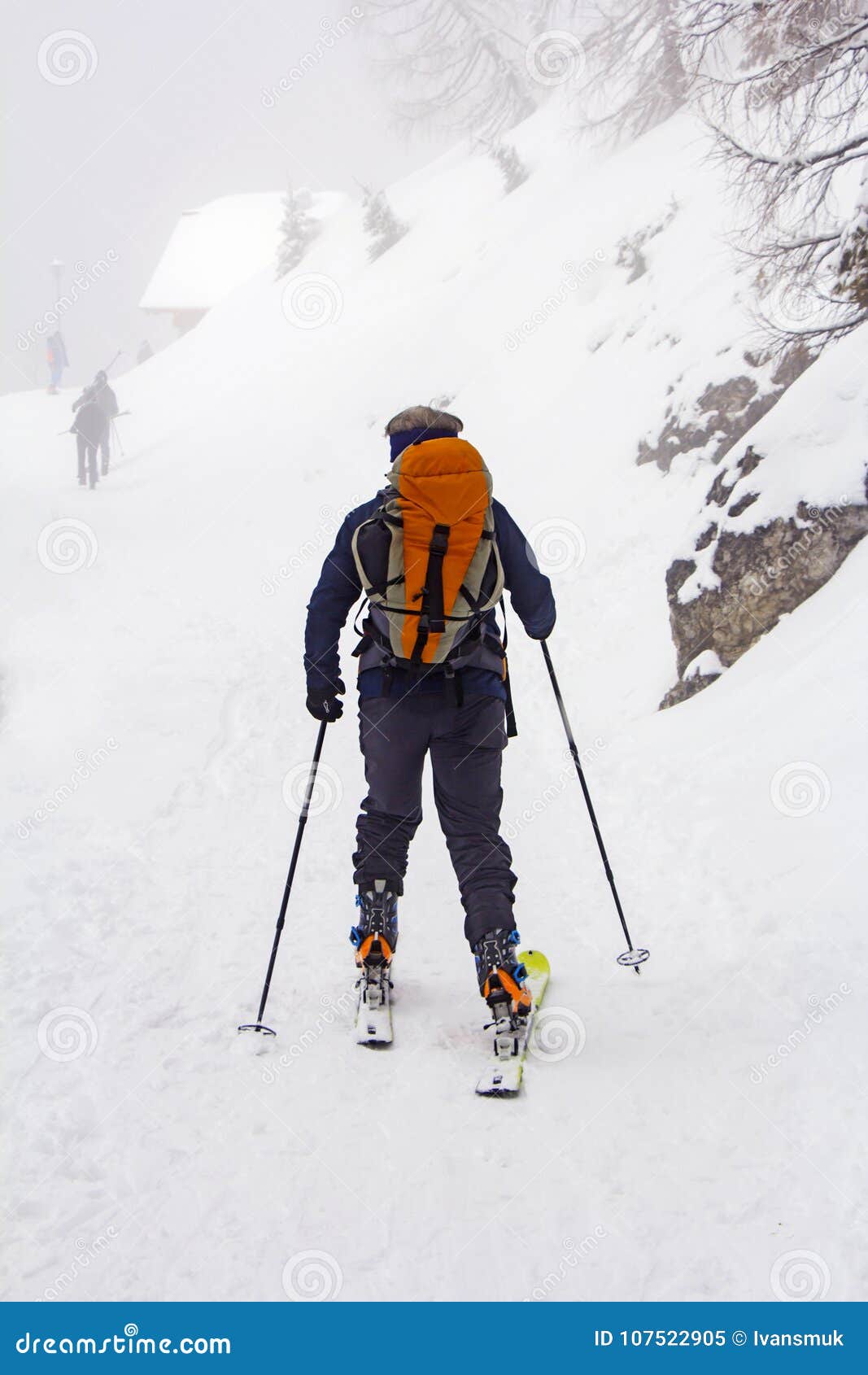 Man with skis walk by snow stock image. Image of adventure - 107522905
