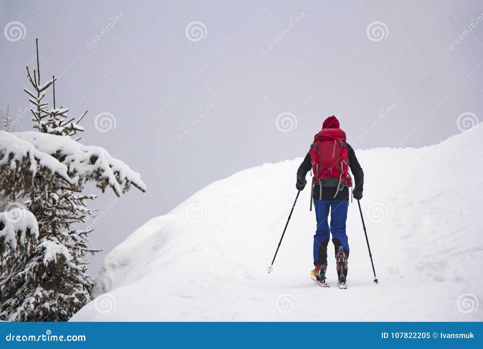 Man with skis walk by snow stock image. Image of season - 107822205