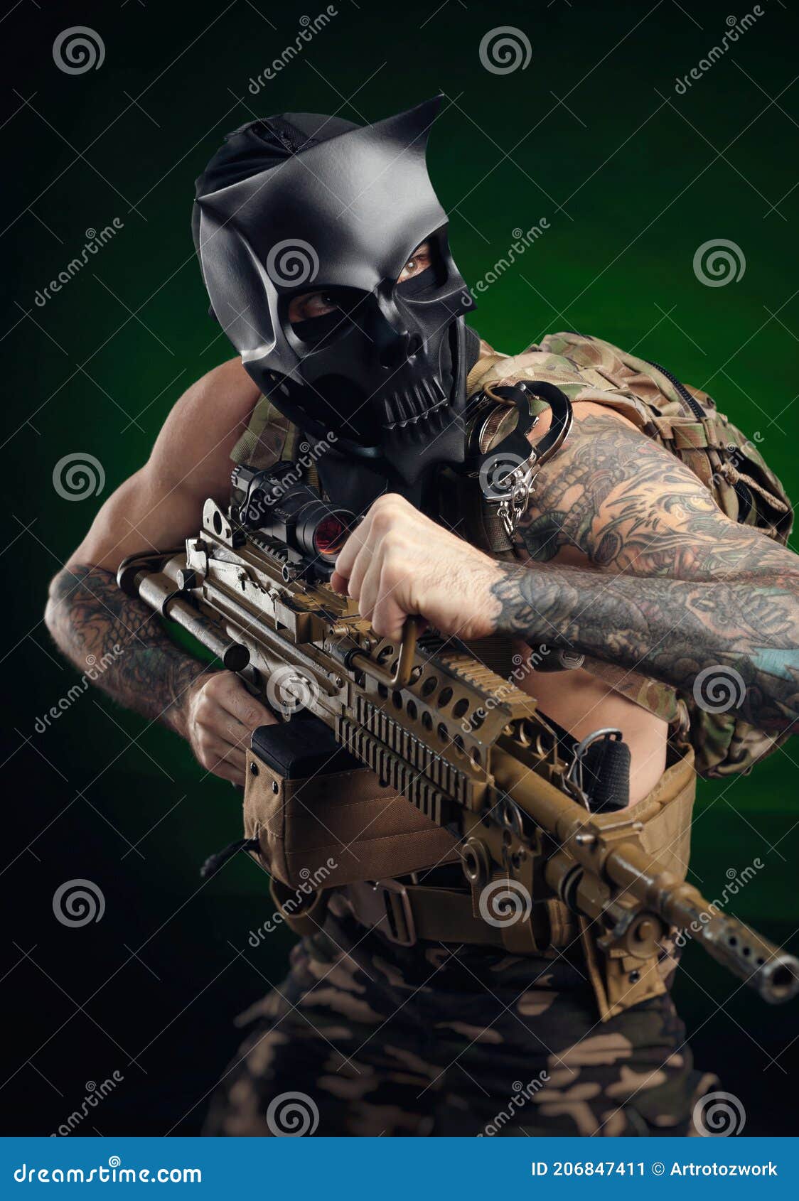 A Man in a Skull Mask with a Machine Gun in His Hands in Tattoos Stock ...