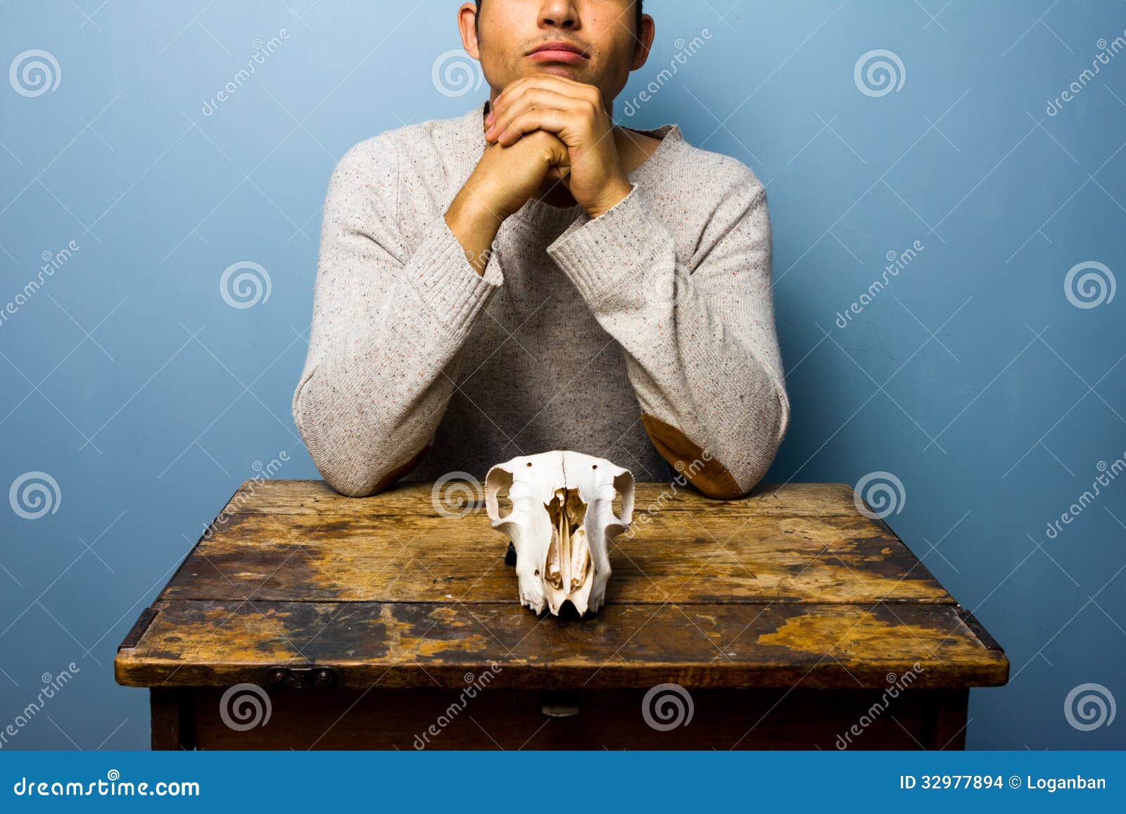 Man with skull is thinking stock photo. Image of background - 32977894