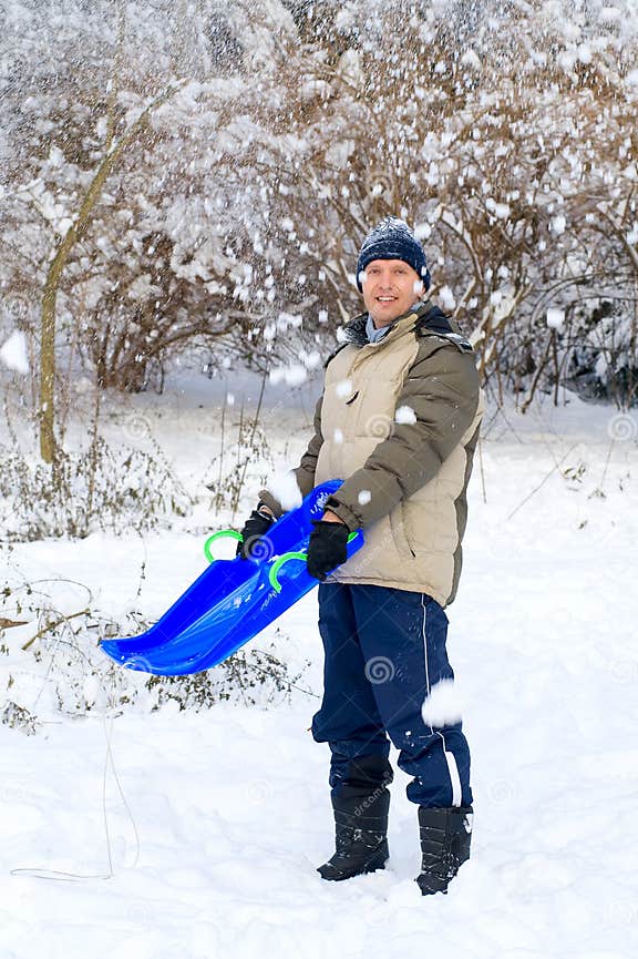 Man with sledge stock image. Image of braking, winter - 12776831