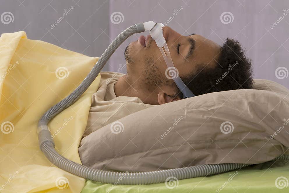 Man with Sleep Apnea Using a CPAP Machine Stock Photo - Image of ...