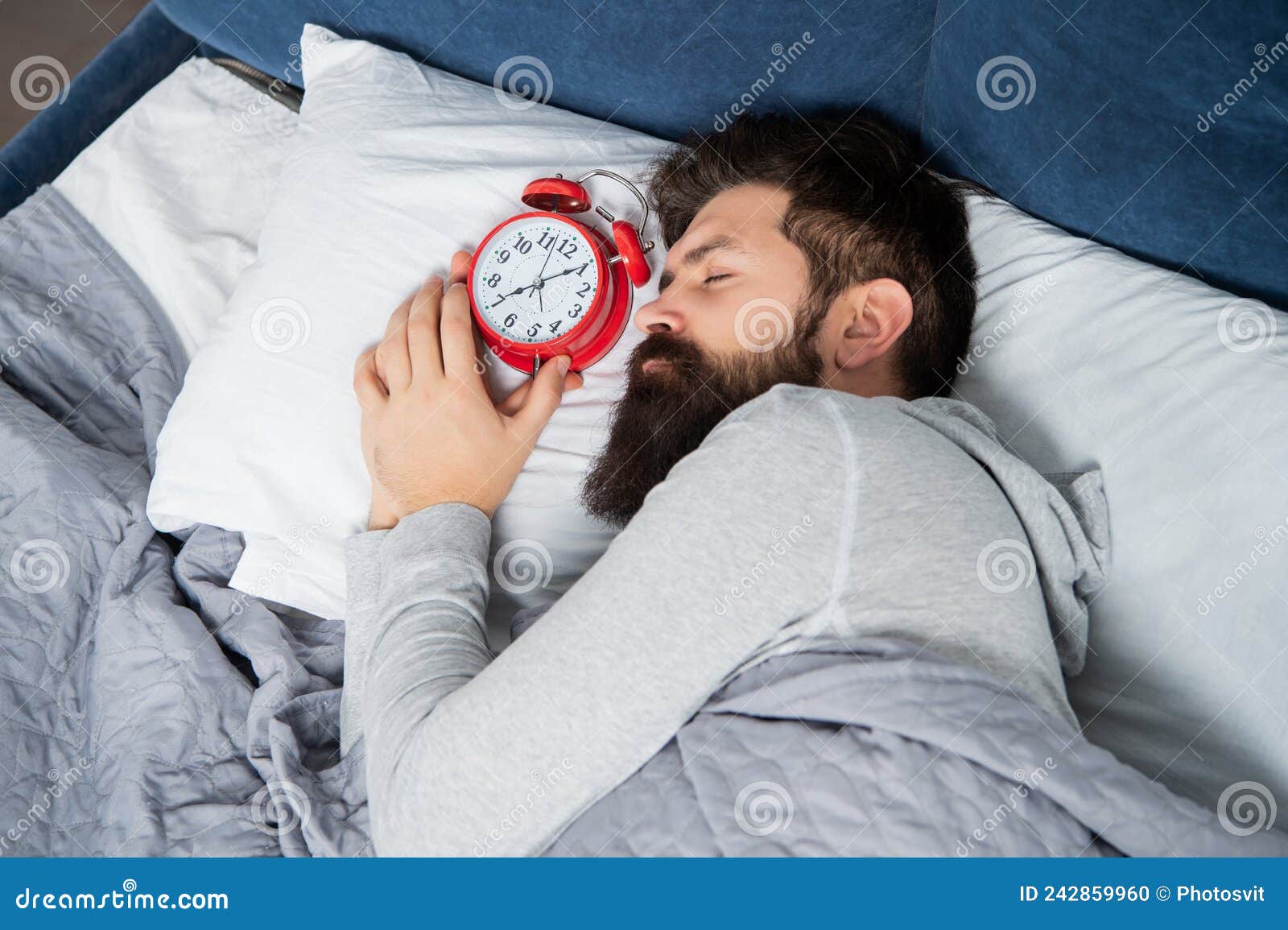 Man Sleeping with Alarm Clock in Bed, Sleep Time Stock Photo - Image of ...