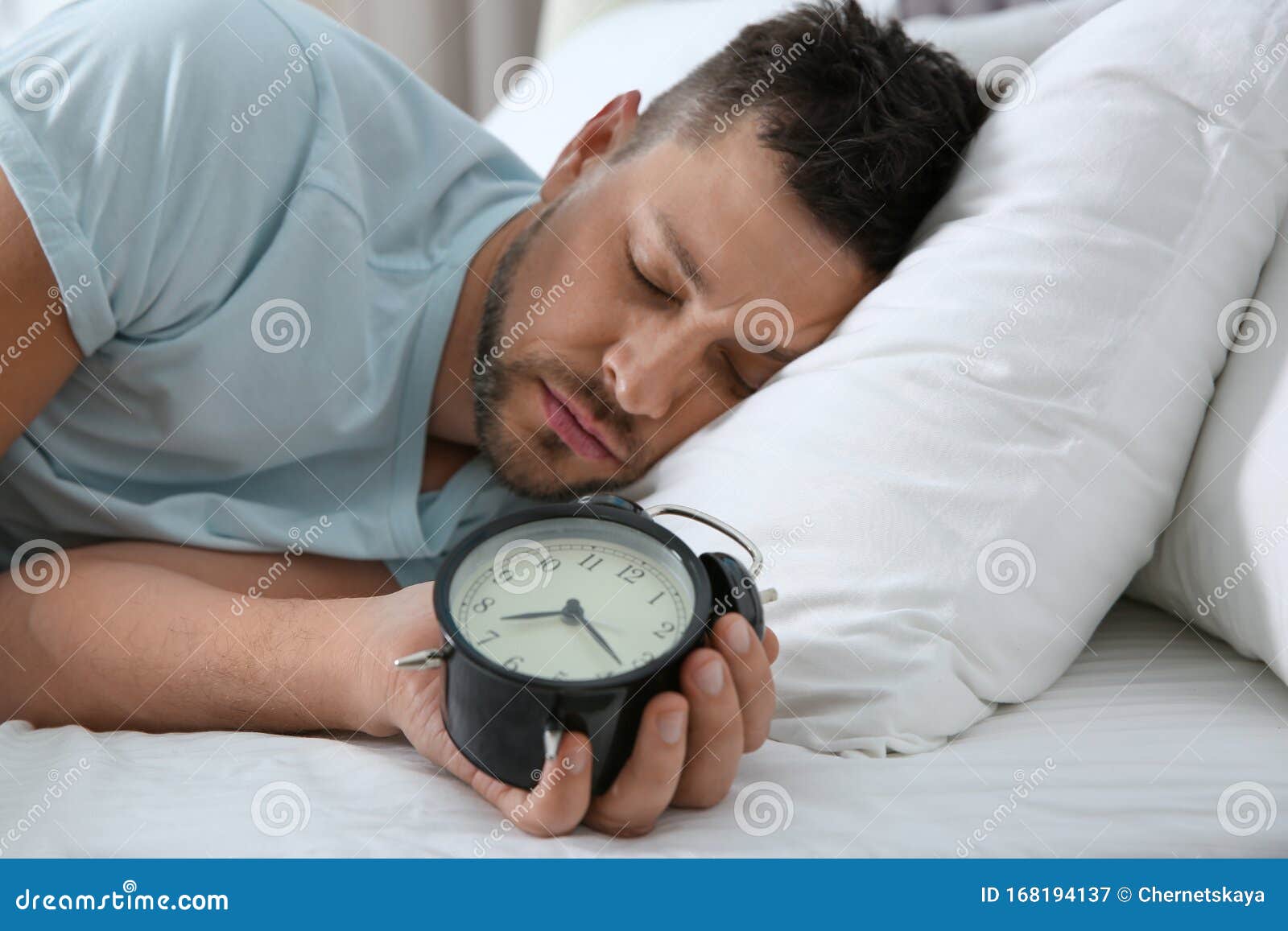 Man Sleeping with Alarm Clock at Home Stock Image - Image of clock ... Man Sleeping with Alarm Clock at Home Stock Image - Image of clock ...