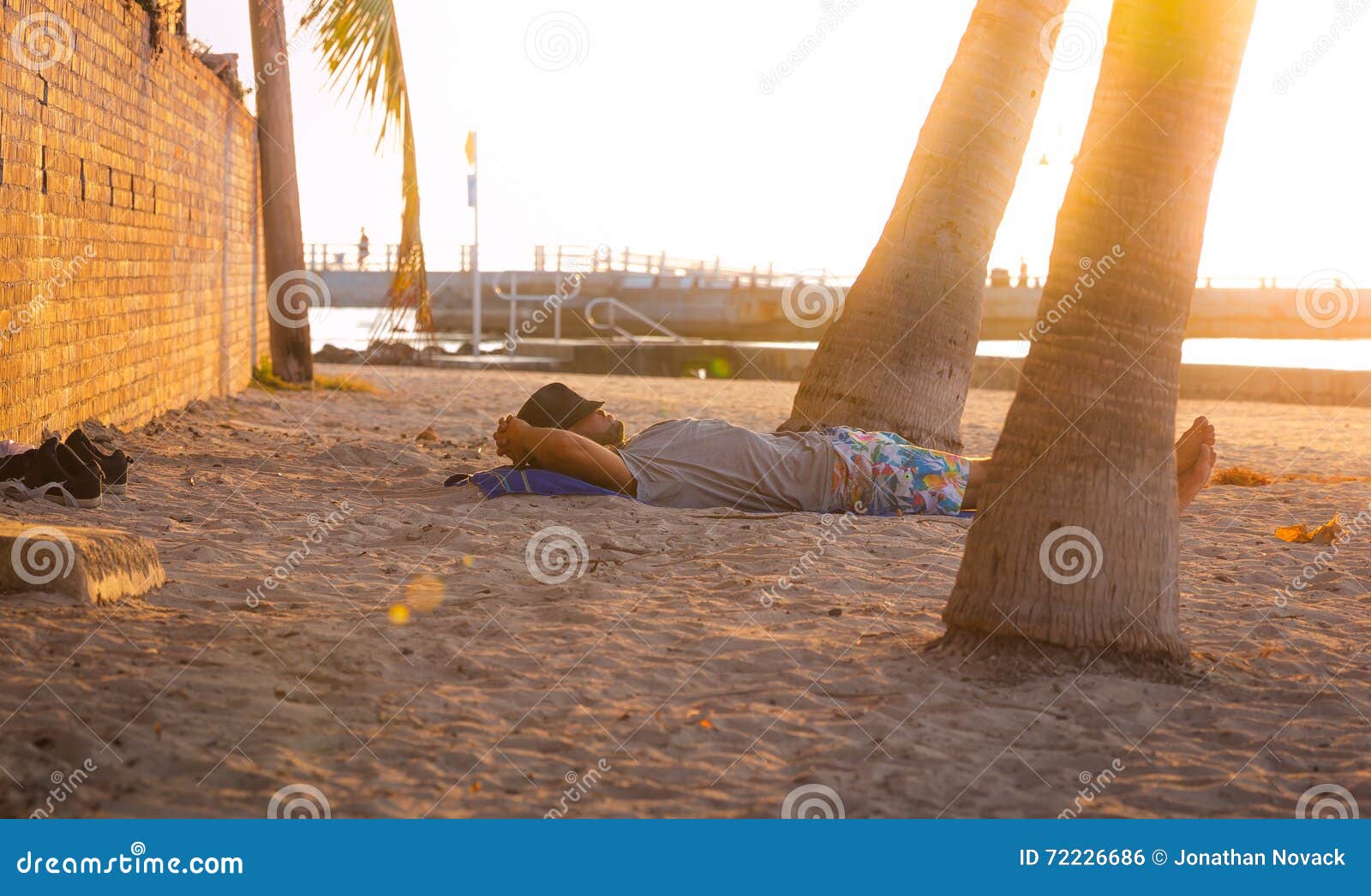 Man Sleeping on Beach stock photo. Image of ocean, asleep - 72226686