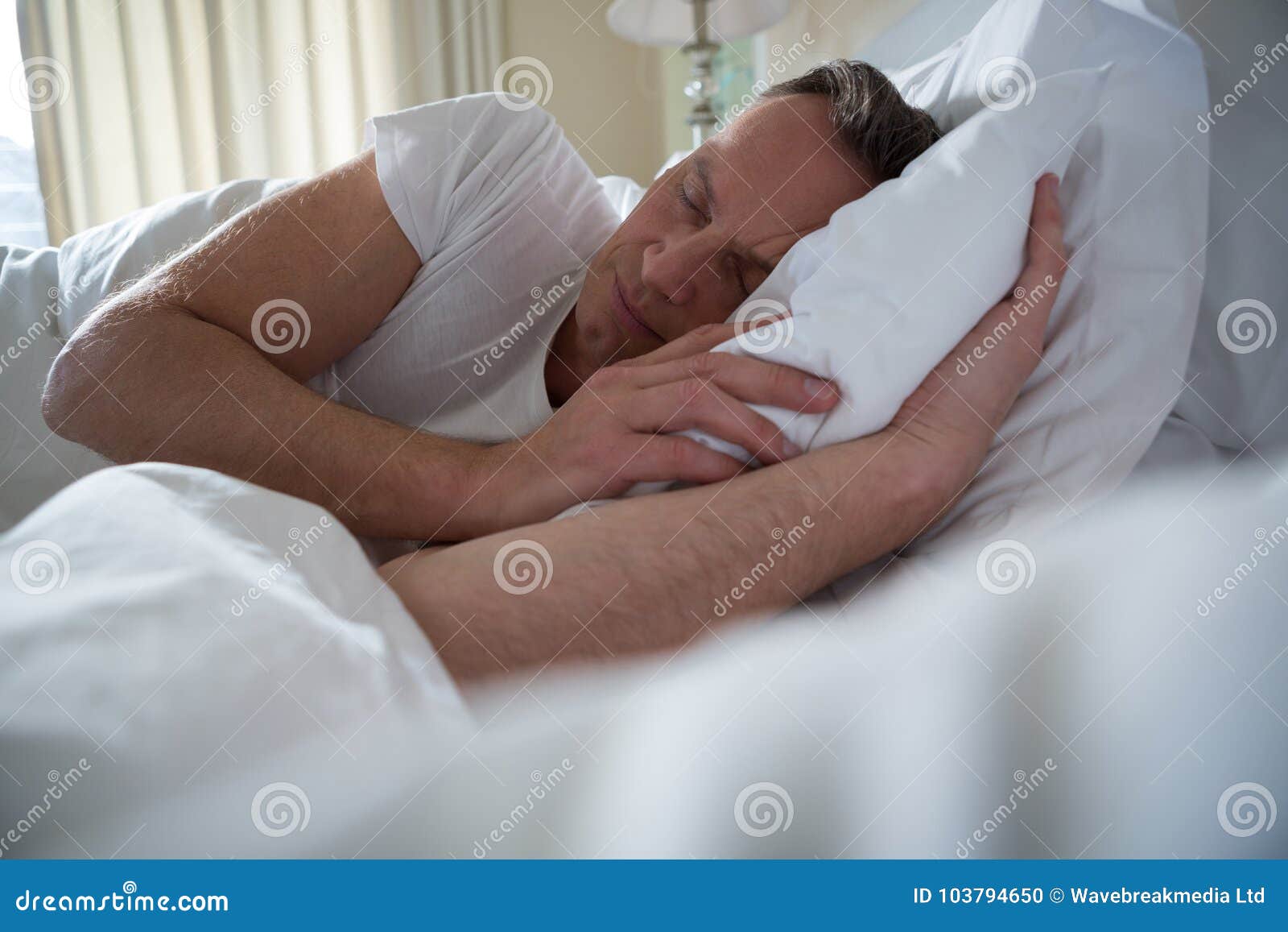 Man Sleeping on Bed in Bedroom Stock Photo - Image of household, male ...