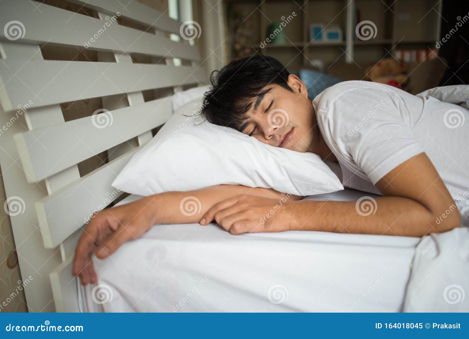 Man sleeping on bed stock image. Image of peaceful, person - 164018045
