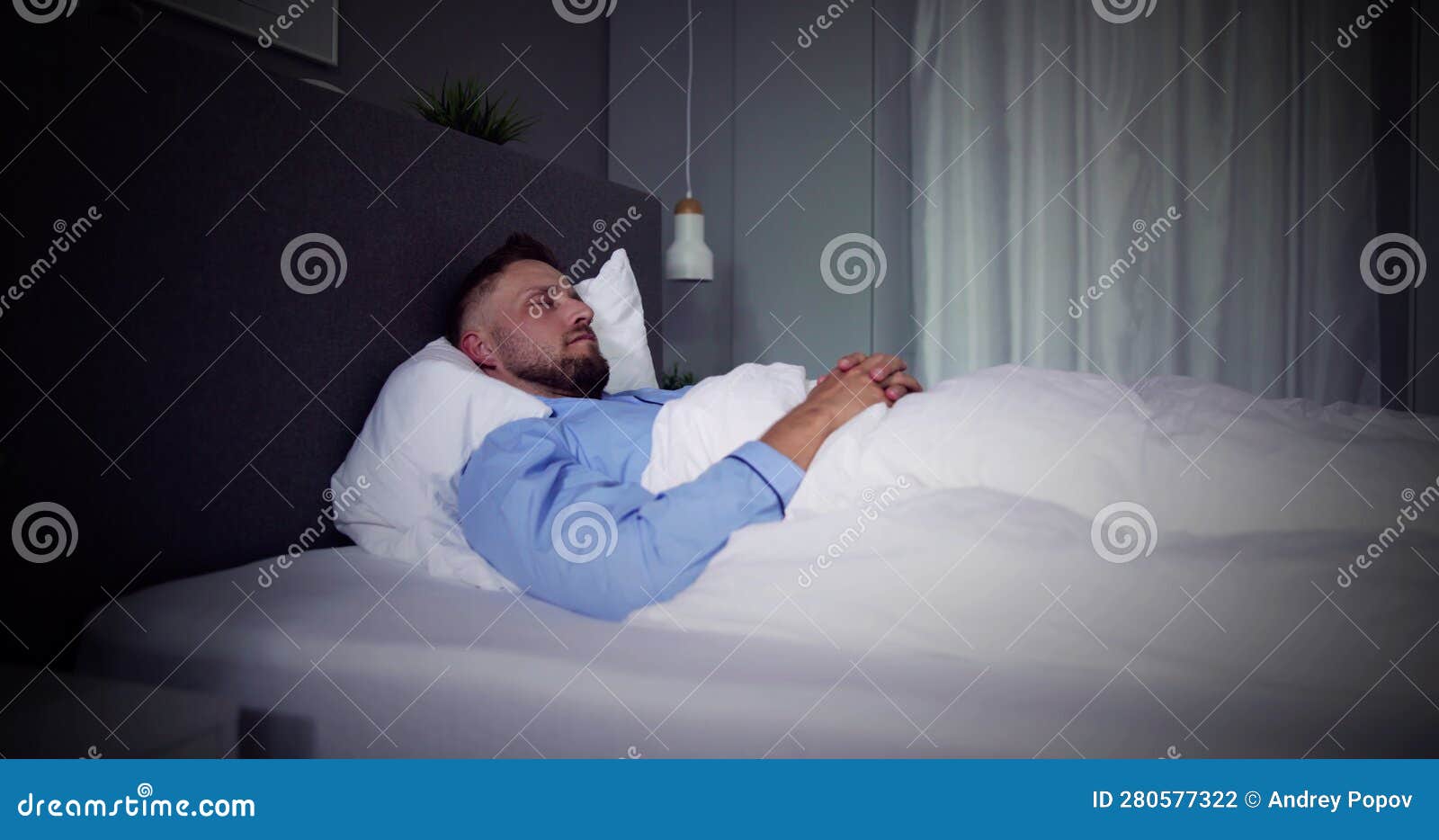 Man Sleeping in Bed stock photo. Image of beauty, morning - 280577322