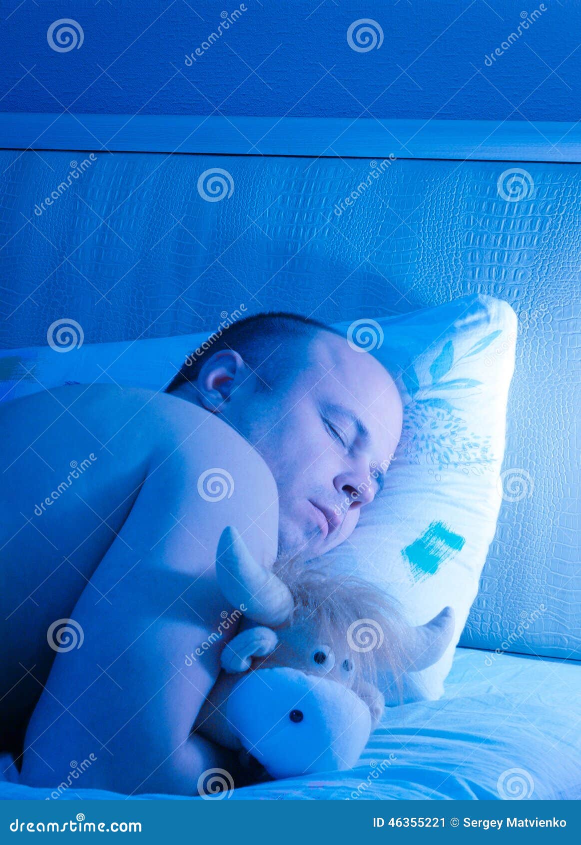 Man Sleeping in an Embrace with a Soft Toy Stock Image - Image of ...