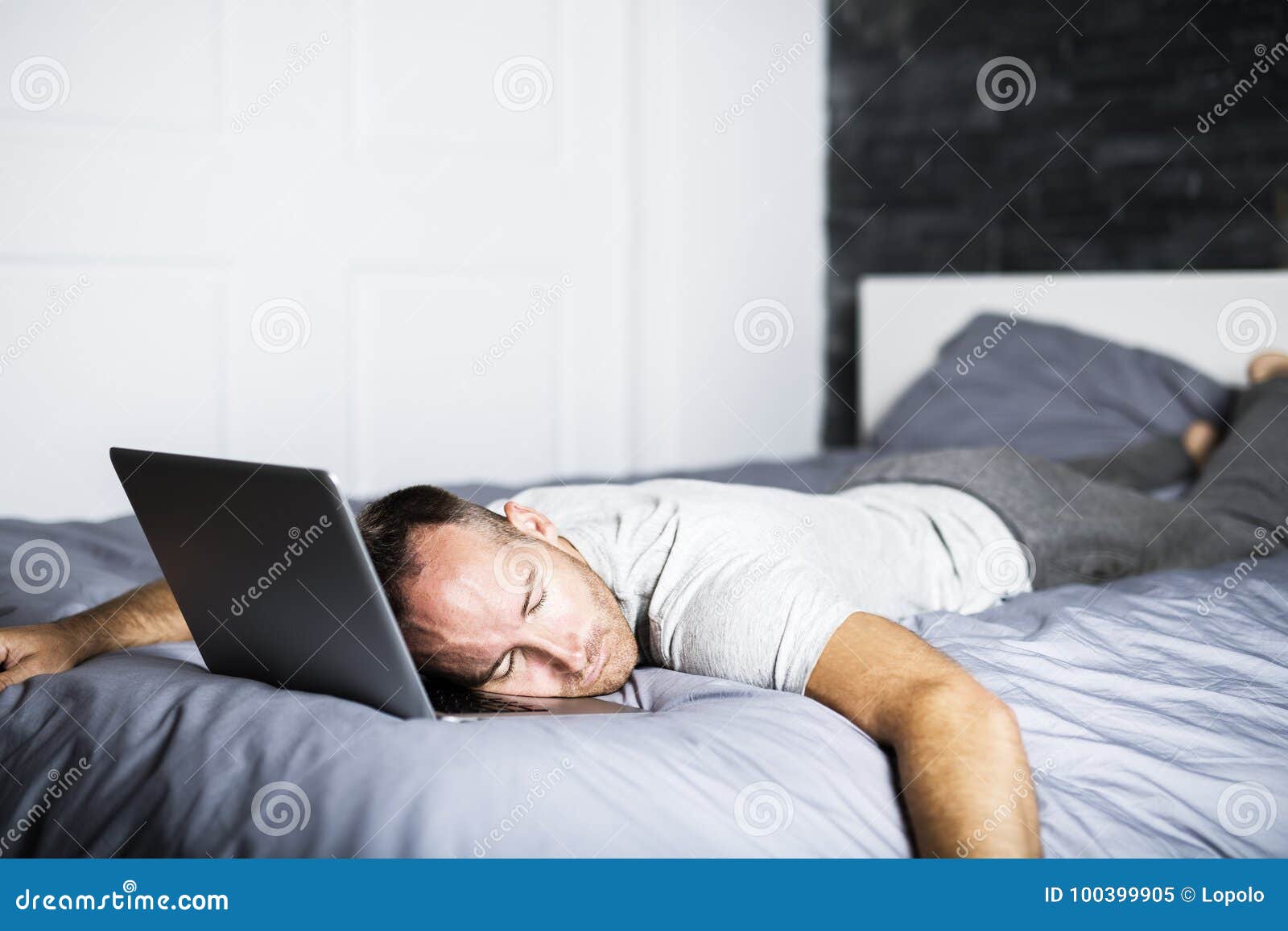 Man Sleeping Over Laptop Computer in Bed Stock Image - Image of casual ...