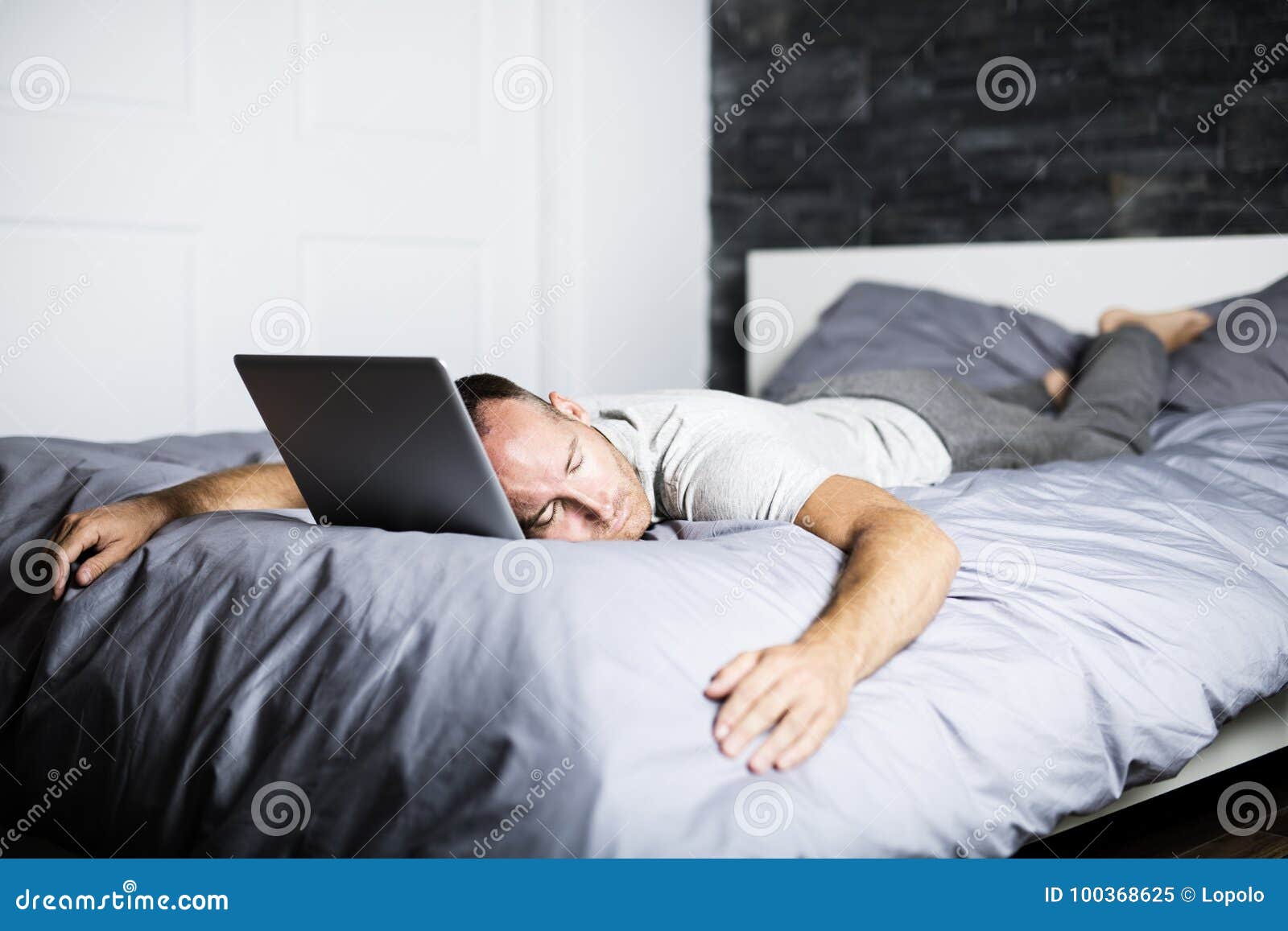 Man Sleeping Over Laptop Computer in Bed Stock Image - Image of home ...