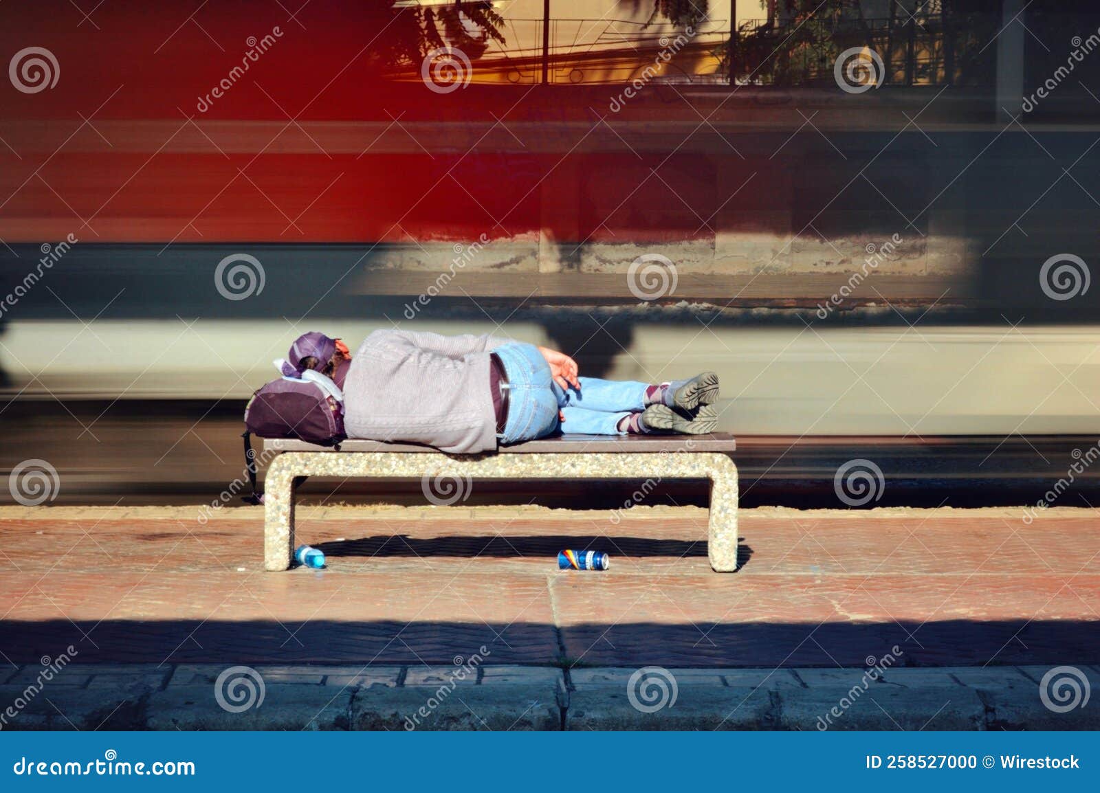 Man Sleeping on a Railway Station Bench Facing the Moving Train Stock ...