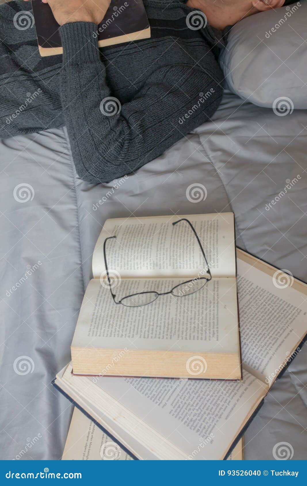 Man sleeping, reading stock photo. Image of novel, male - 93526040
