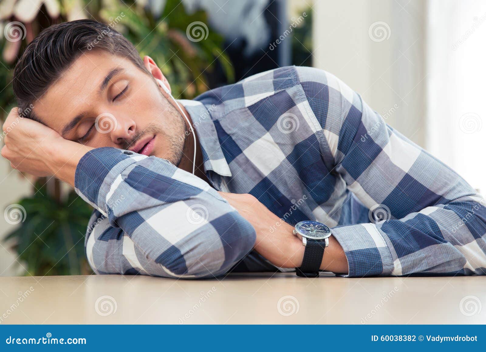 Man sleeping at the table stock photo. Image of brunette - 60038382