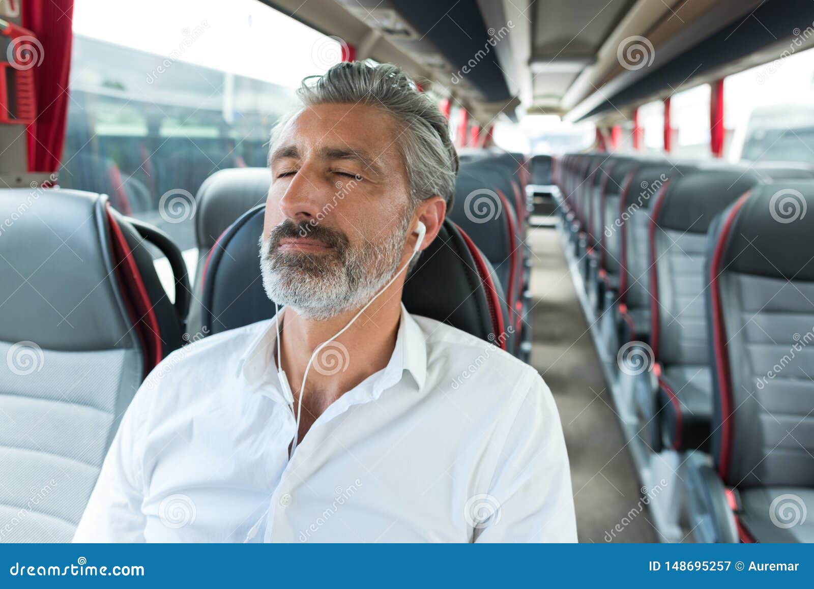 Man sleeping in travel bus stock image. Image of pillow - 148695257