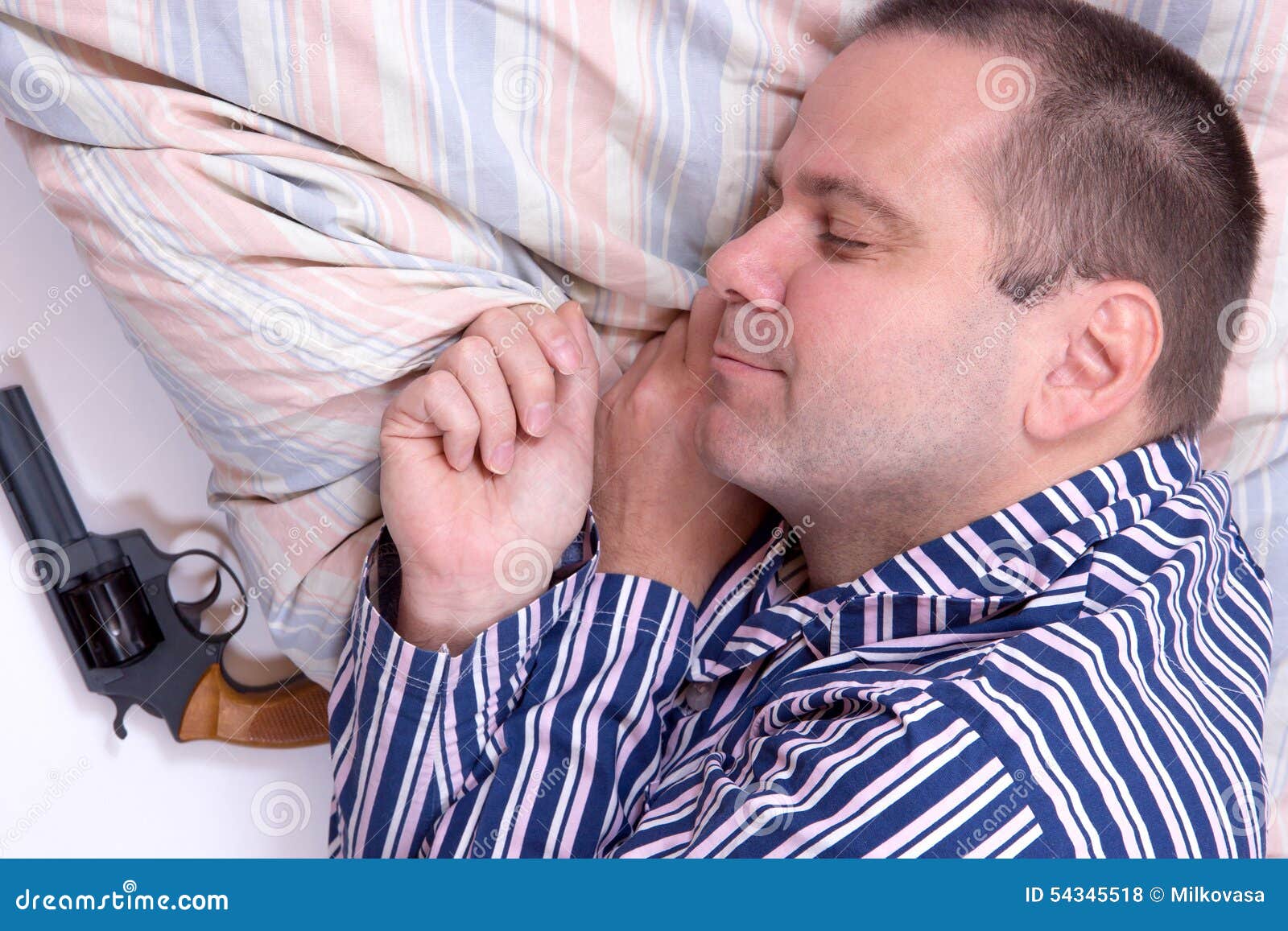 A man sleeps with a gun stock photo. Image of people - 54345518