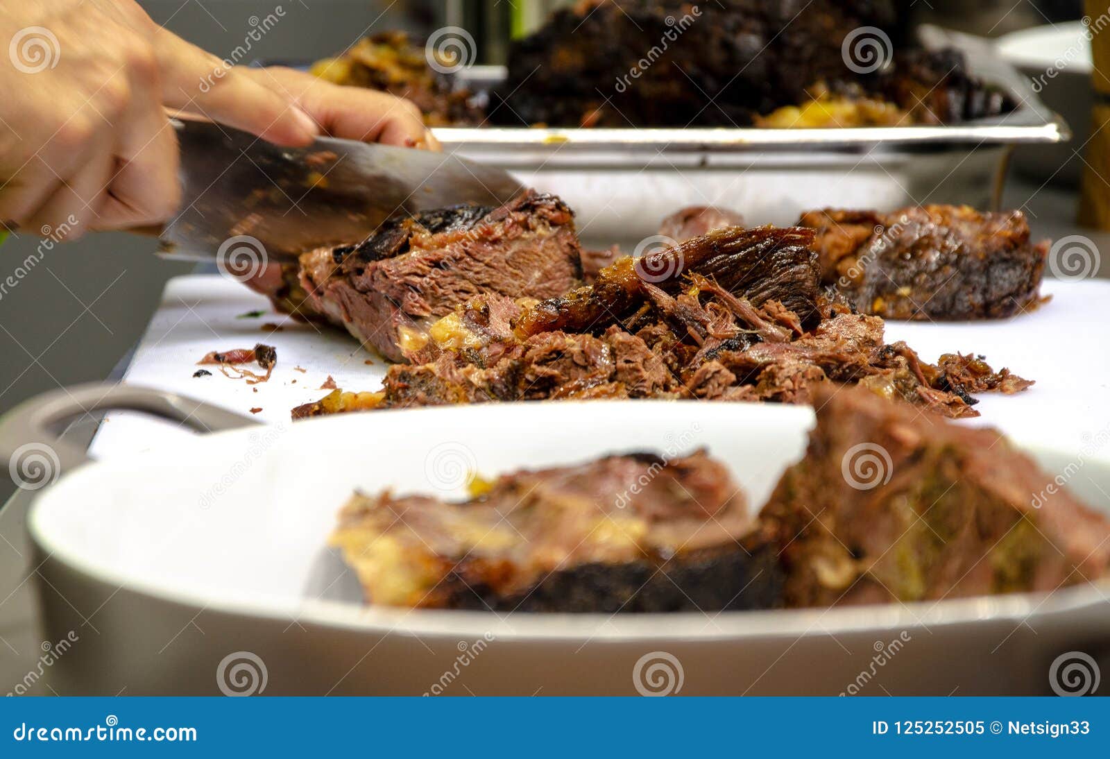 Man slicing cooked meat stock image. Image of chef, background - 125252505