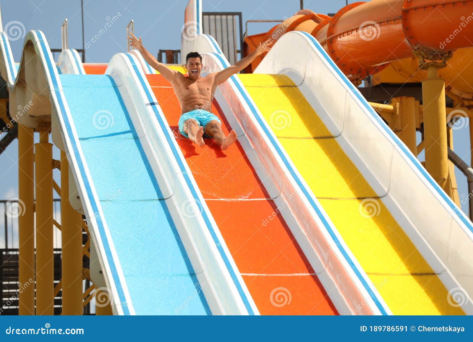 Man on Slide at Water Park. Summer Stock Image - Image of resort, adult ...