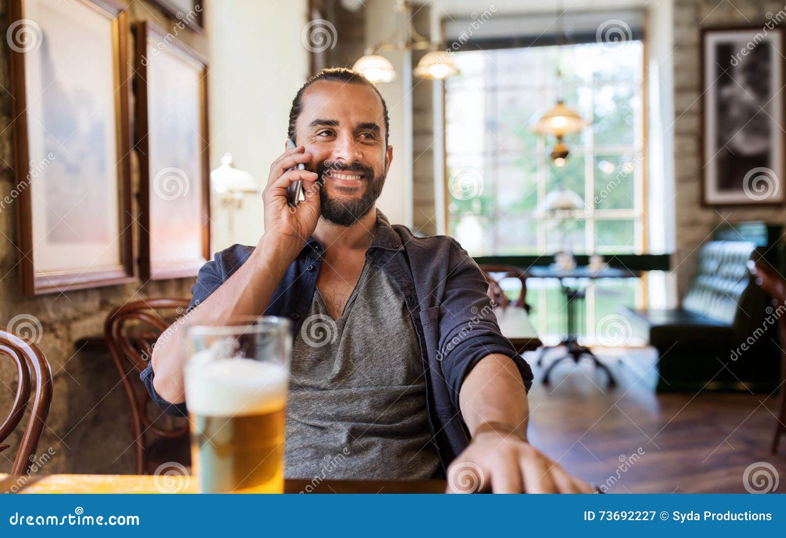 Man with Smartphone and Beer Calling at Bar or Pub Stock Image - Image ...