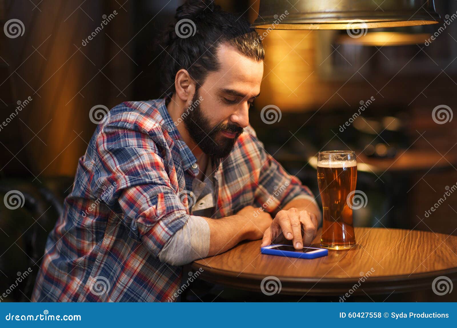 Man with Smartphone and Beer Texting at Bar Stock Photo - Image of ...