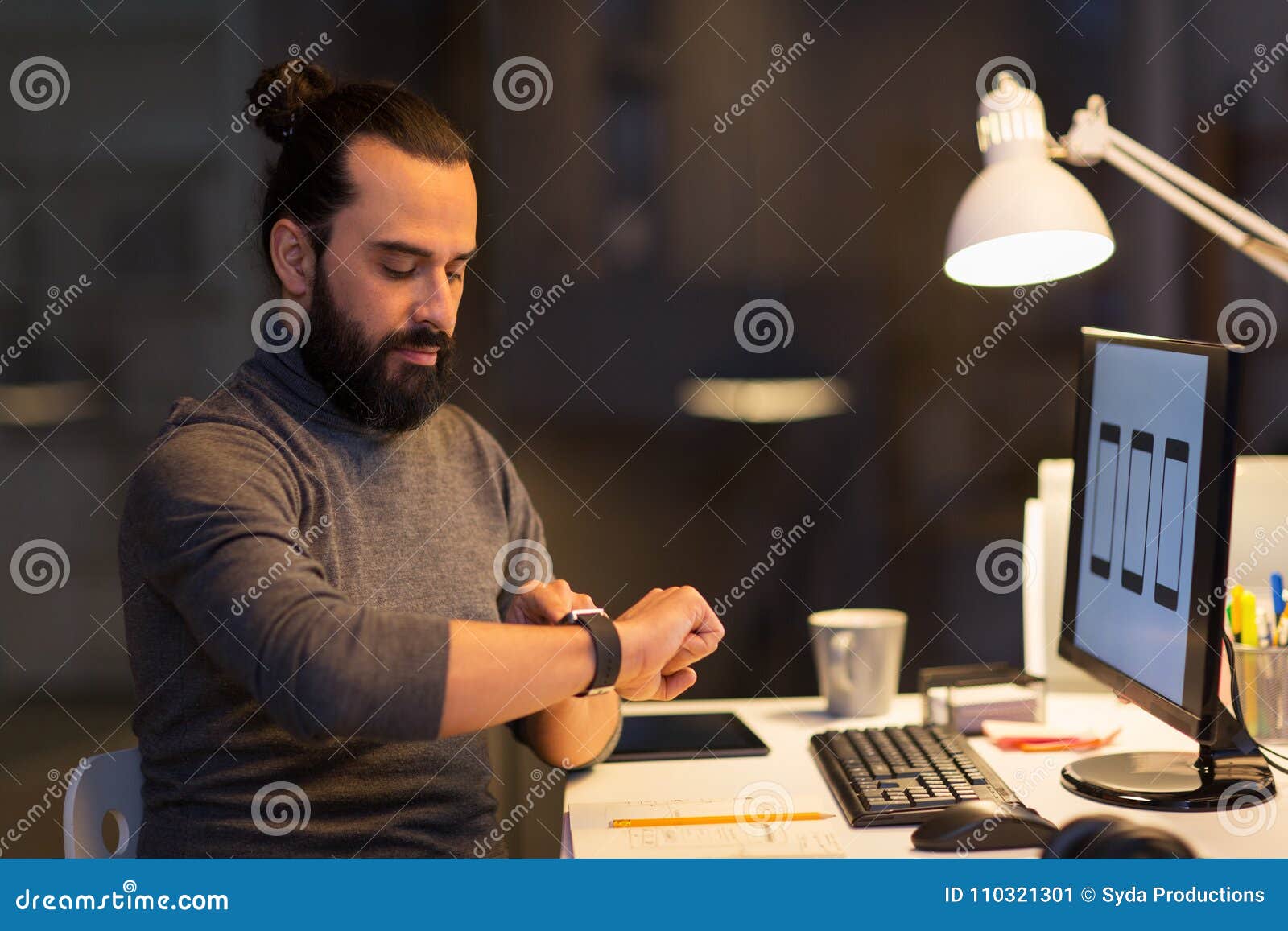 Man with Smartwatch and Computer at Night Office Stock Image - Image of ...