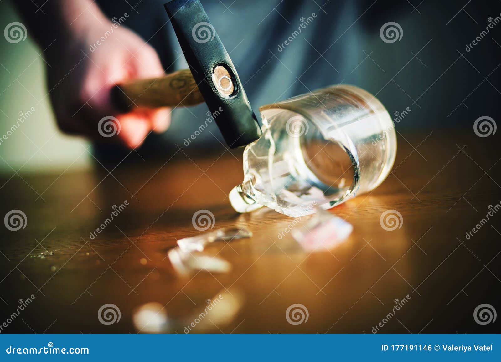 The Man Smashed a Glass Mug with a Hammer, Which Shattered. Dangerous ...