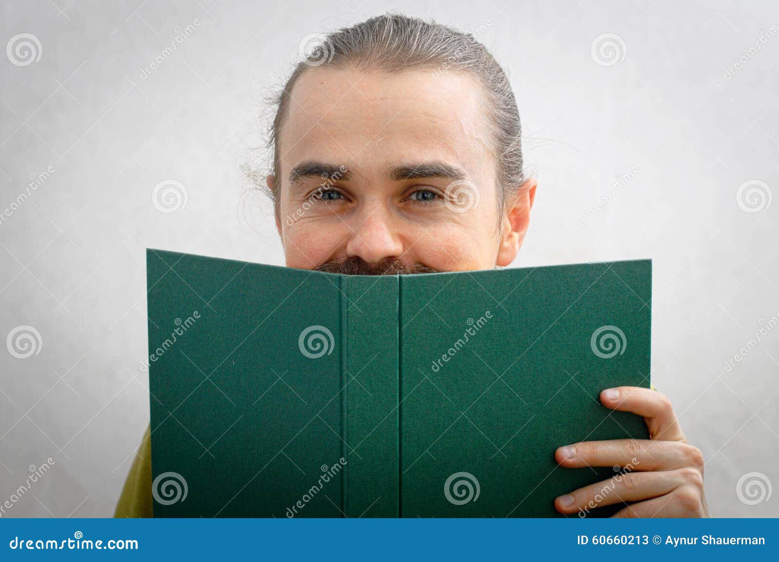 Man Smiling from Behind the Book Stock Image - Image of beard, page ...