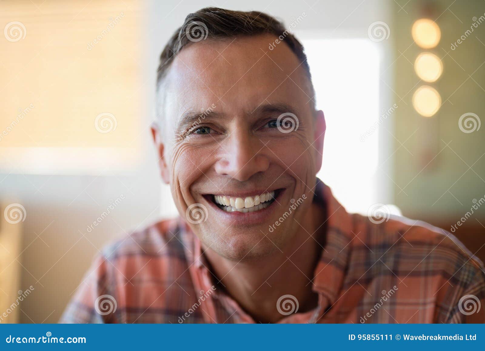 Man Smiling at Camera in Restaurant Stock Image - Image of handsome ...
