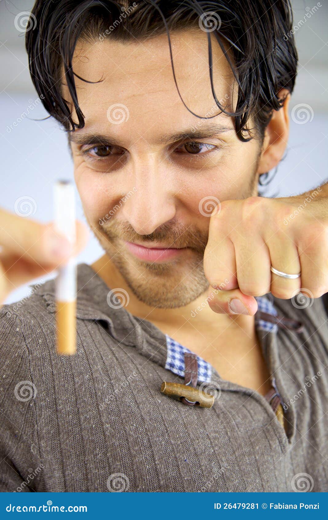 Man Smiling at Cigarette Ready To Stop Smoking Stock Image - Image of ...