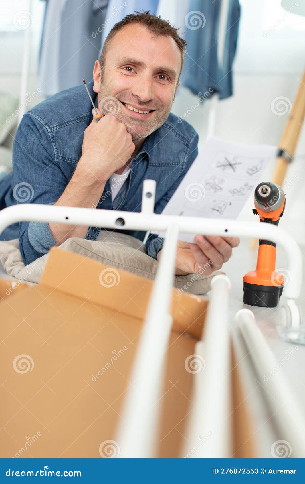 Man smiling with drill stock image. Image of marketing - 276072563