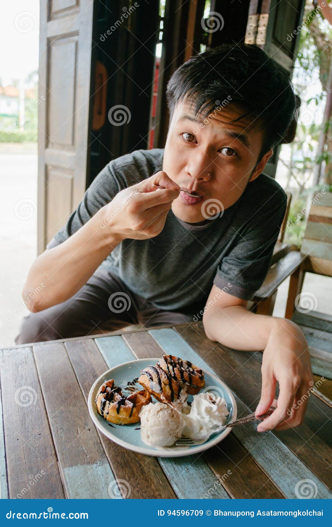 Man Smiling Eating Waffle with Ice-cream at Vintage Cafe Stock Image ...