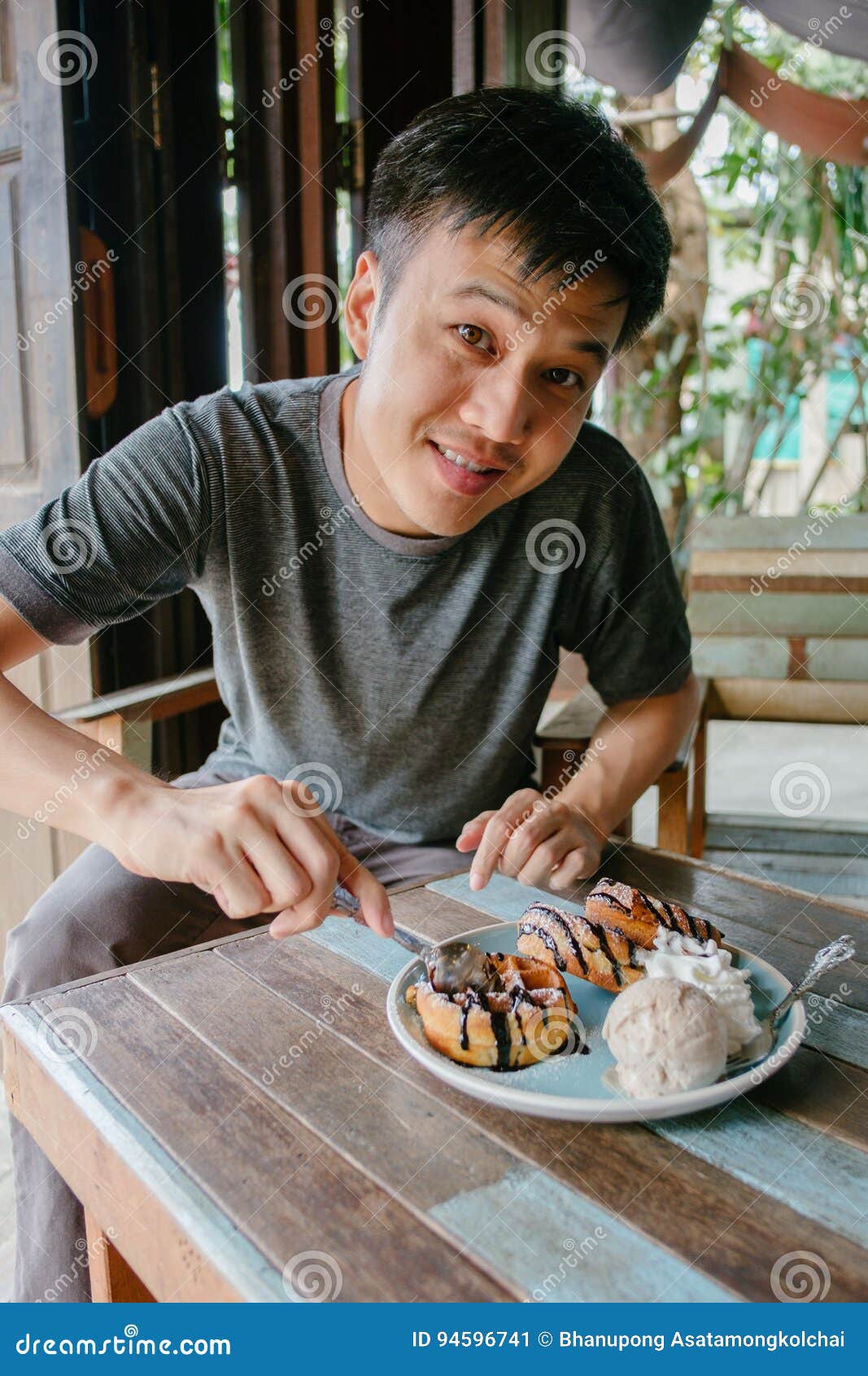 Man Smiling Eating Waffle with Ice-cream at Vintage Cafe Stock Image ...