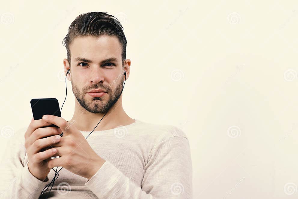 Man With Smiling Face With Telephone Guy With Beard Holds Mp3 Player
