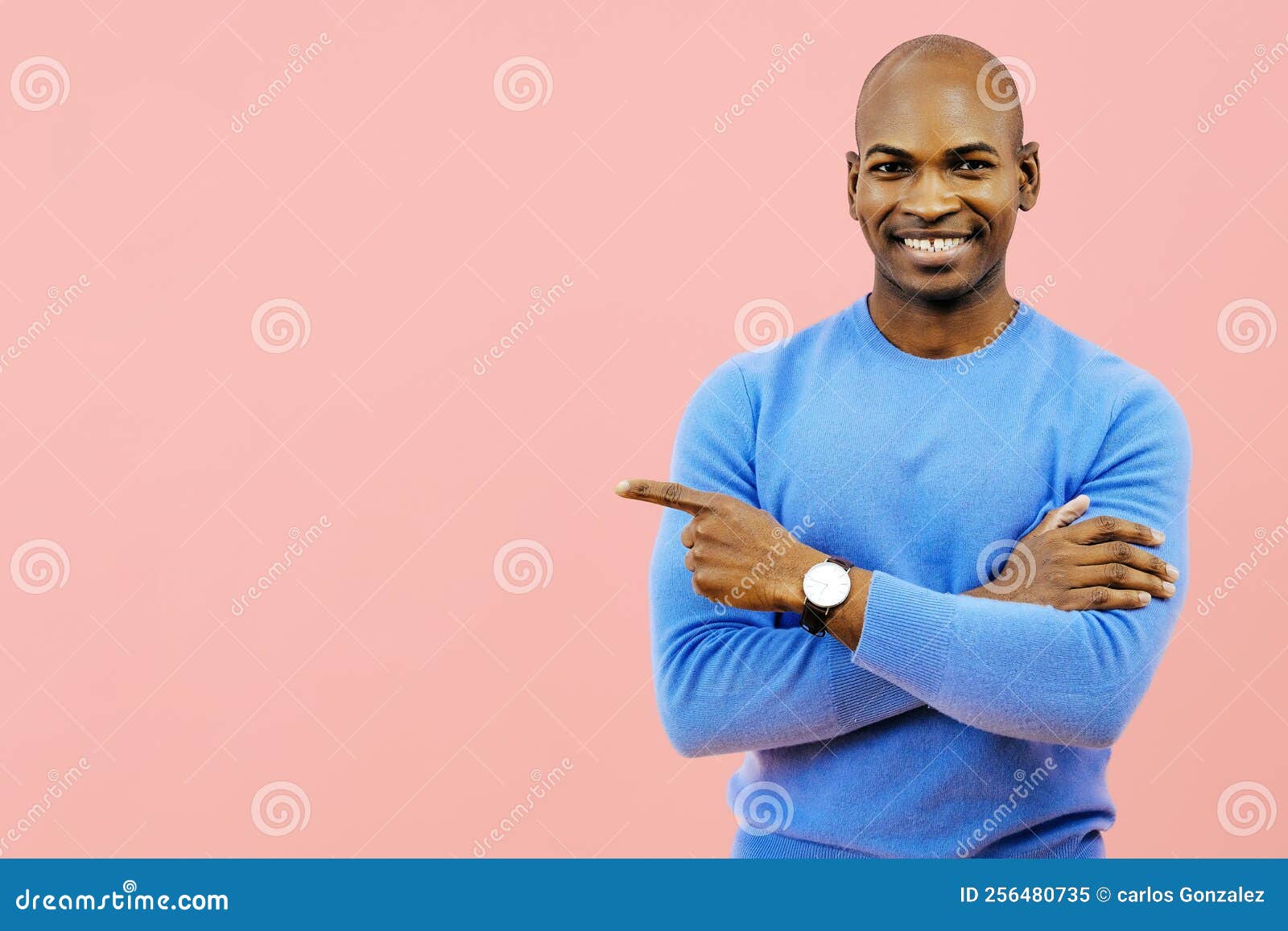 Man Smiling with Folded Arms Pointing at Copy Space Stock Image - Image ...