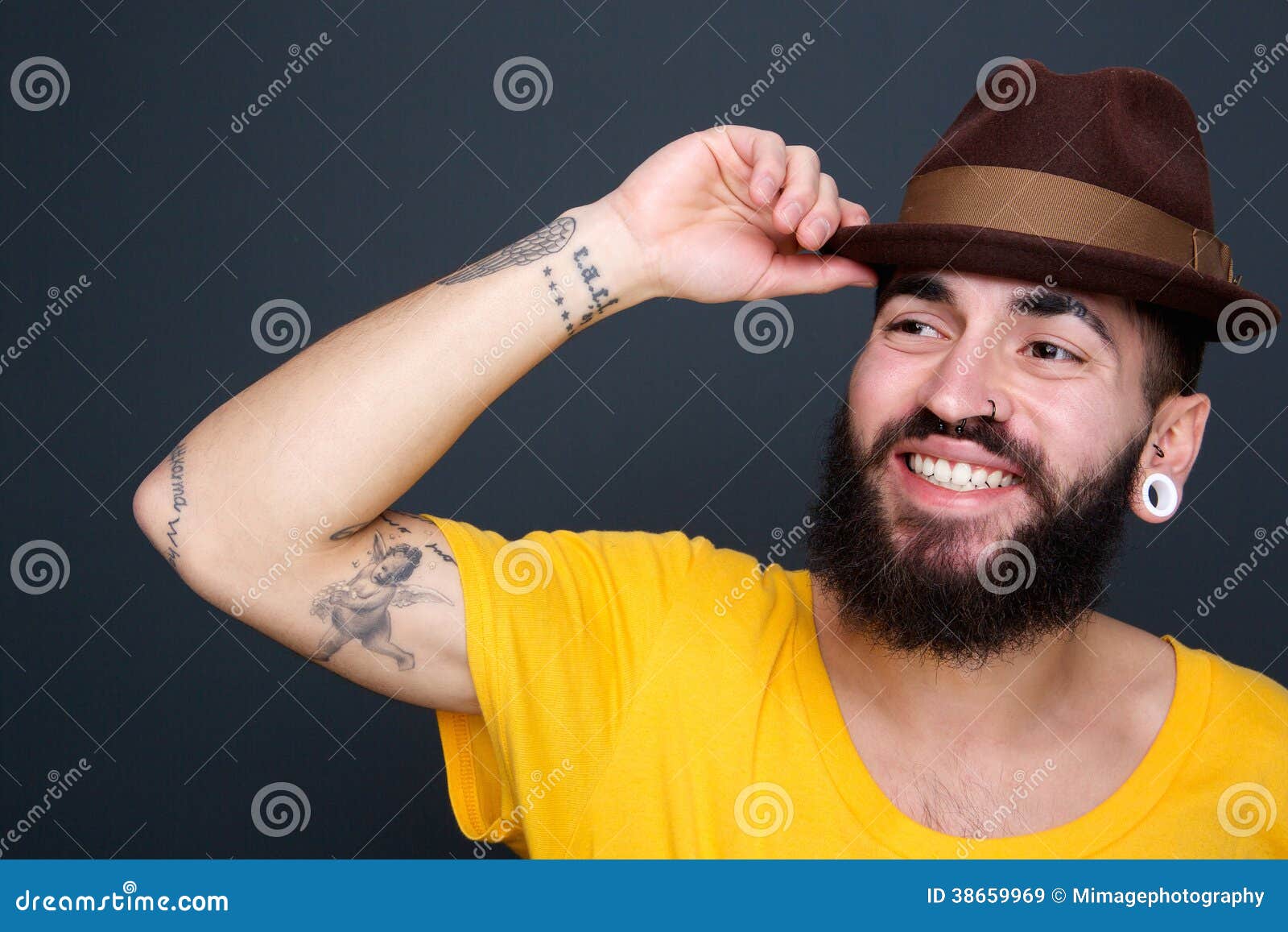 Man Smiling with Hat on Gray Background Stock Image - Image of beauty ...