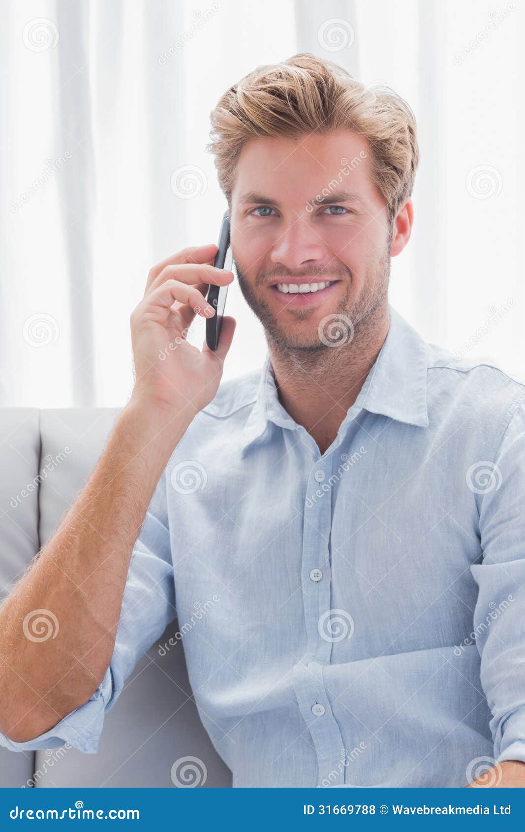 Man Smiling while he is Having a Phone Conversation Stock Photo - Image ...