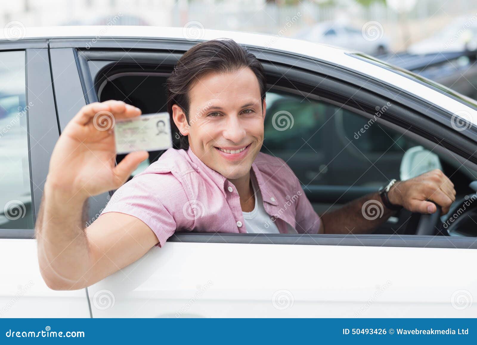 Man Smiling and Holding His Driving License Stock Photo - Image of ...